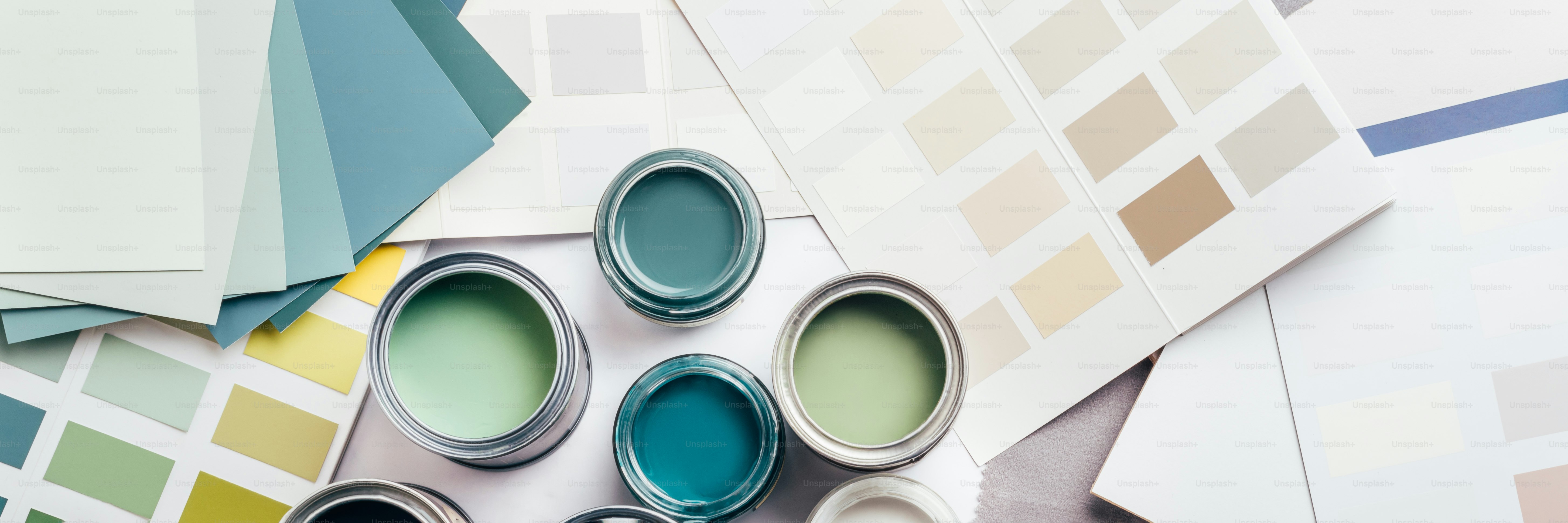 Tiny sample paint cans during house renovation, process of choosing ...