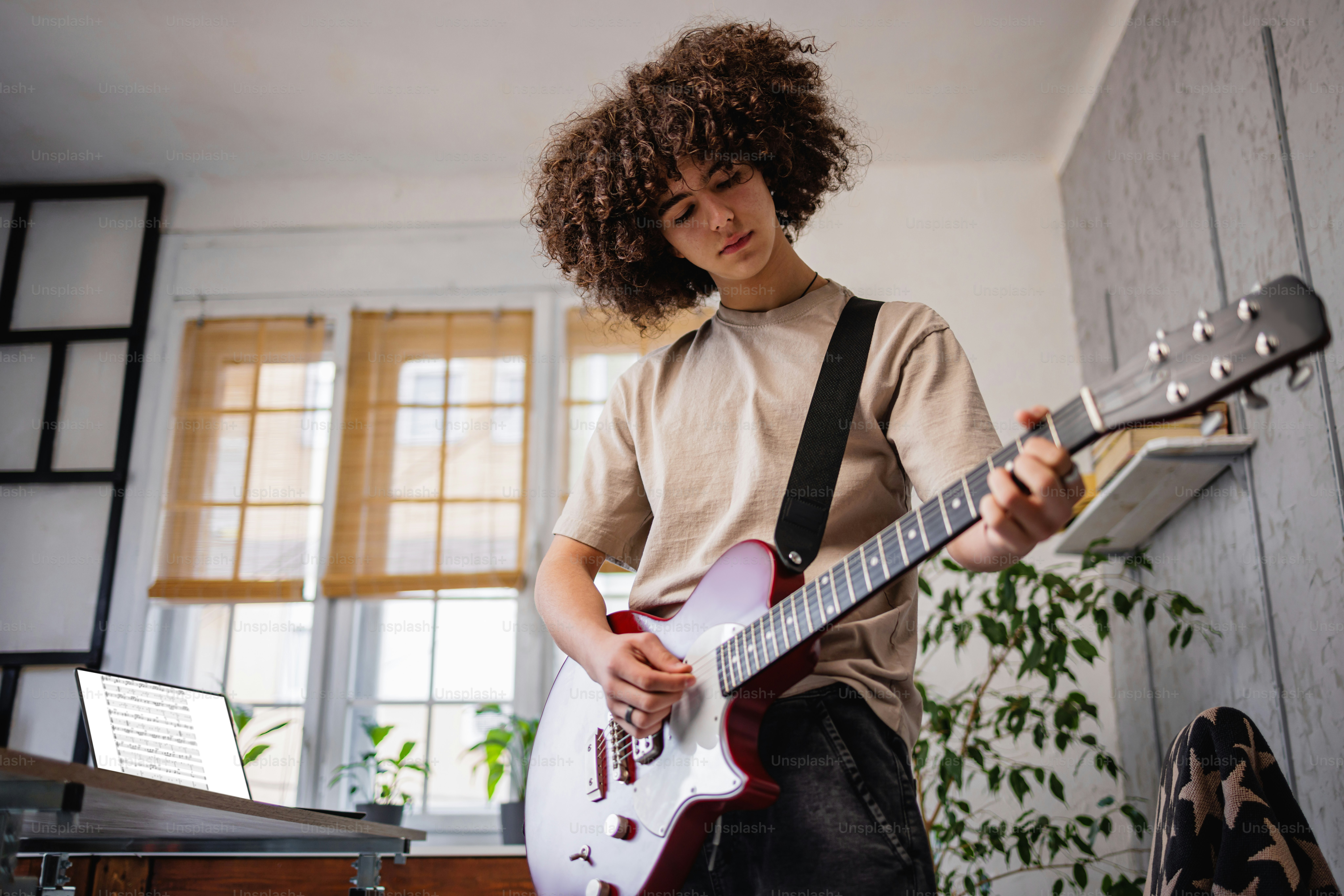 Young musician play electric guitar photo – Leisure activity Image on ...
