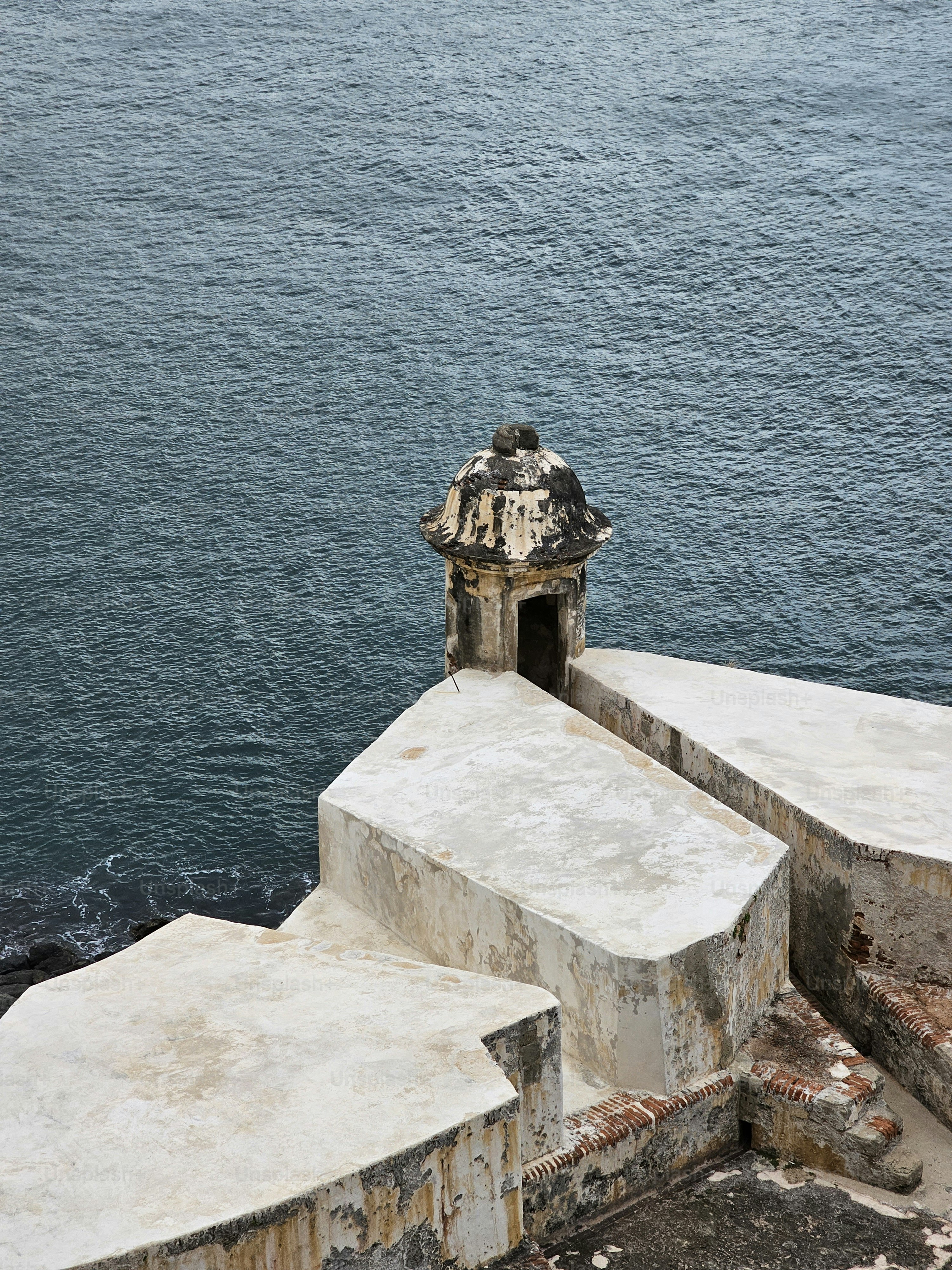 Small military tower over the ocean in Old San Juan photo – Sunny Image ...