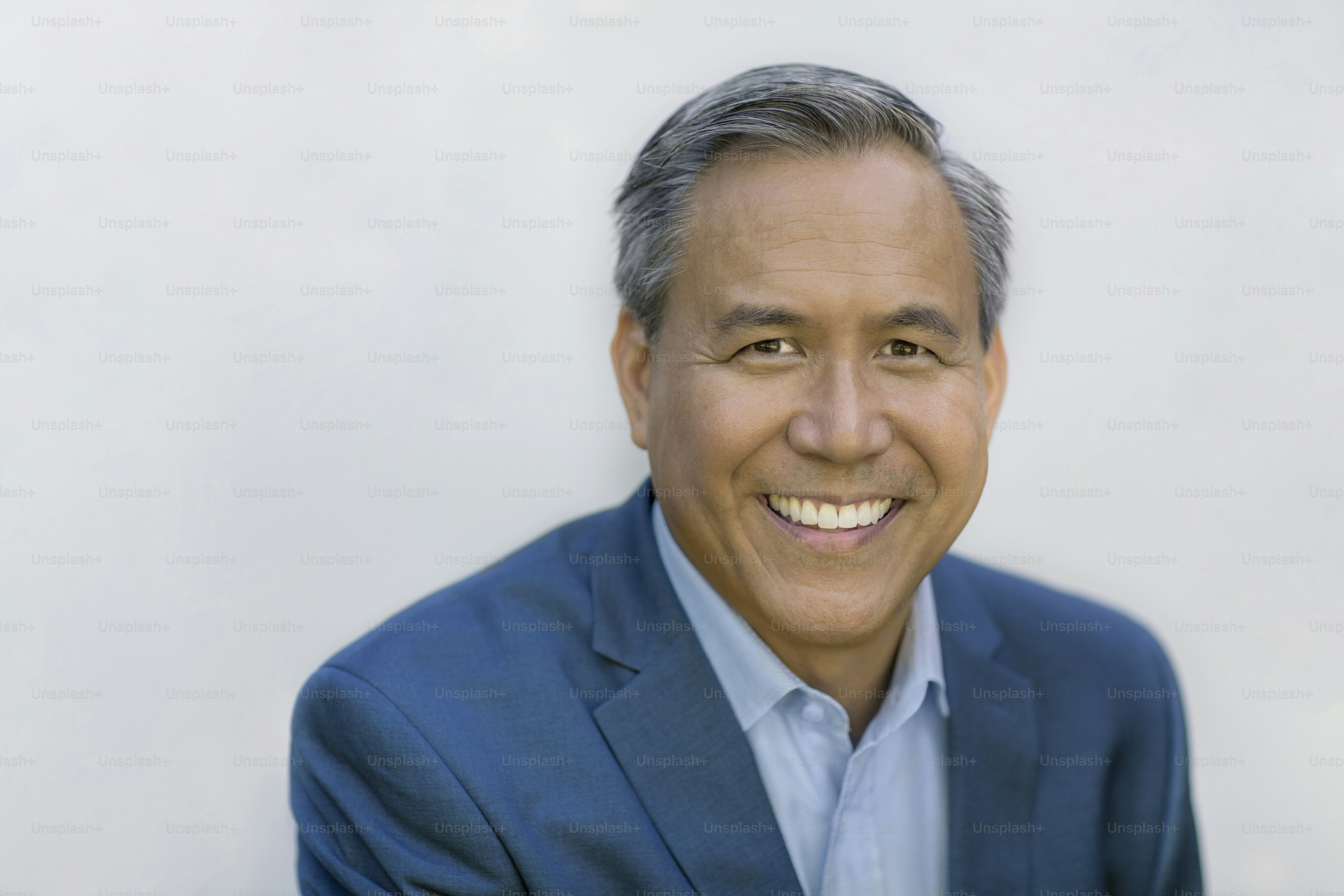 Portrait of Asian Chinese mixed race senior mature man in blazer jacket ...