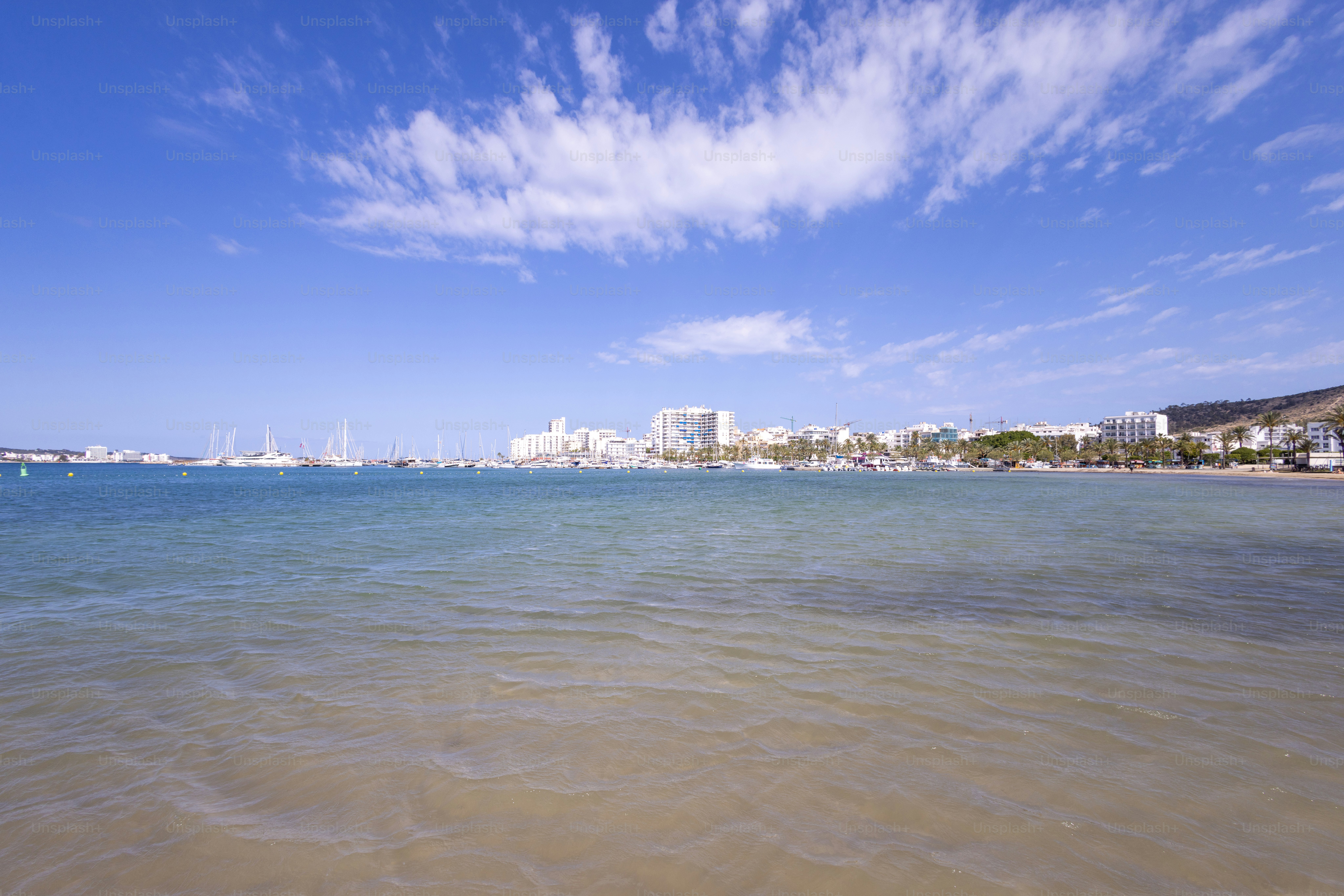Photo of the beach from in the town of Sant Antoni de Portmany on the ...
