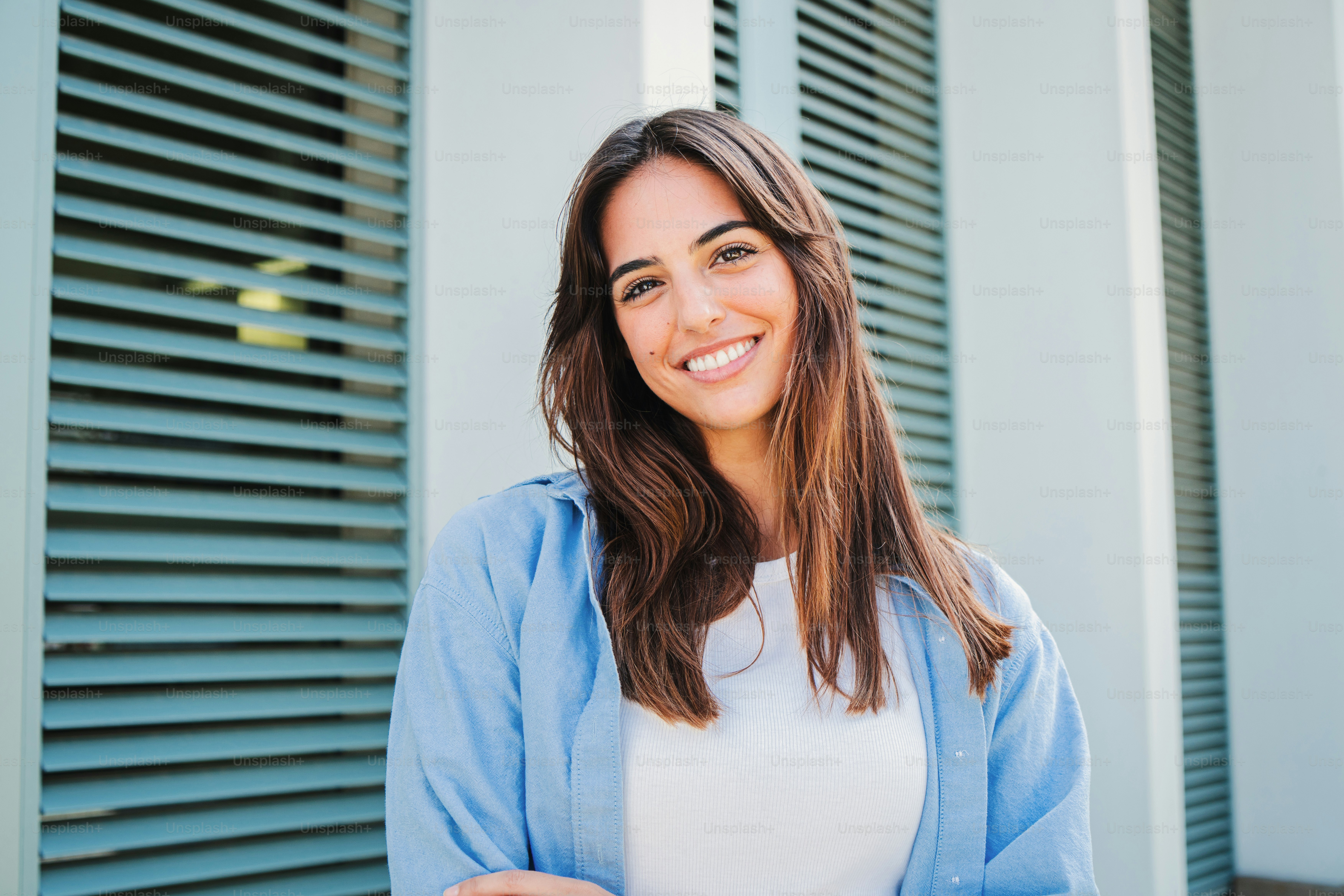 Happy caucasian young student female looking at camera enjoying with a ...