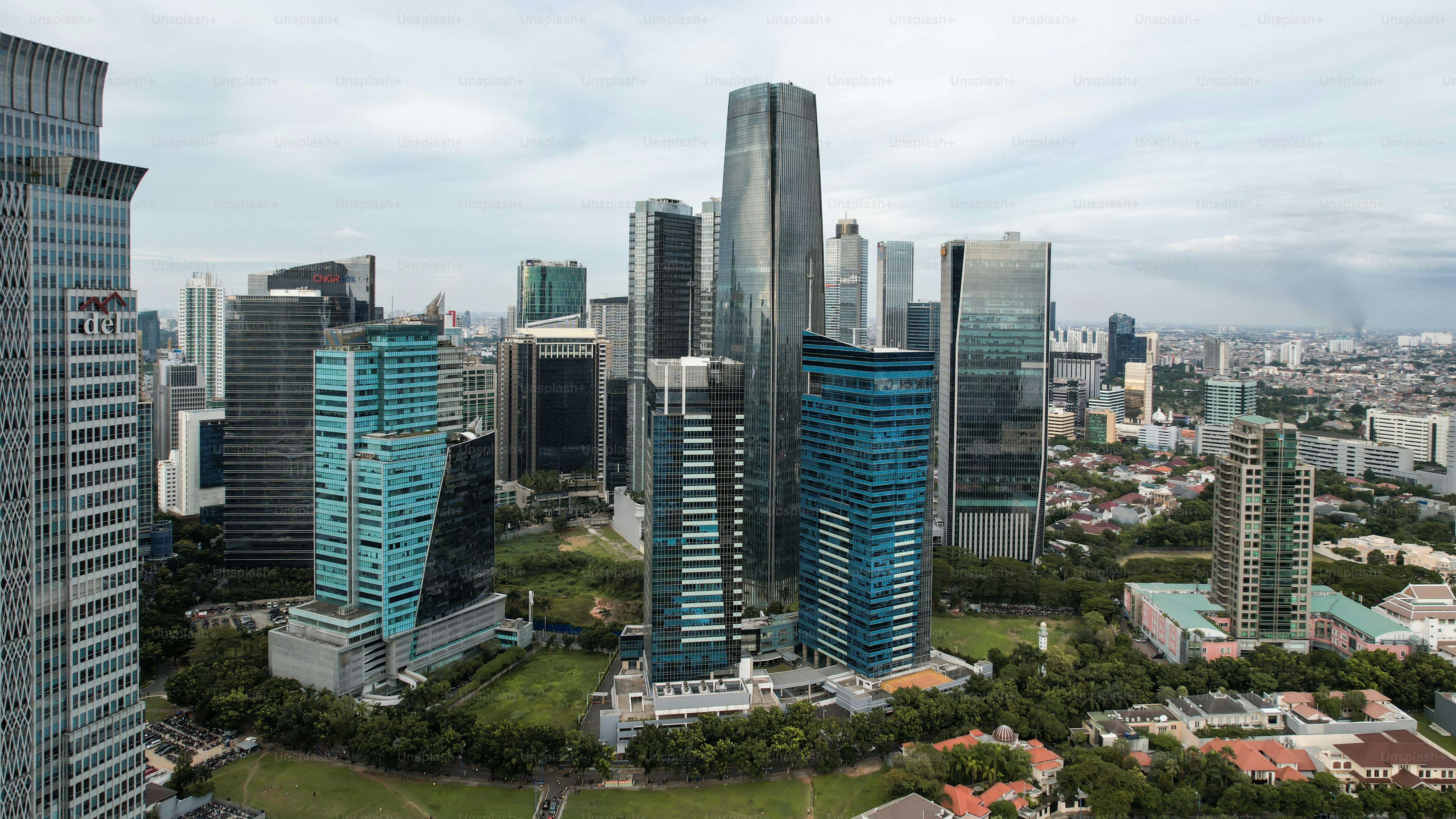 Panoramic cityscape of Indonesia capital city Jakarta at sunset. A rare ...