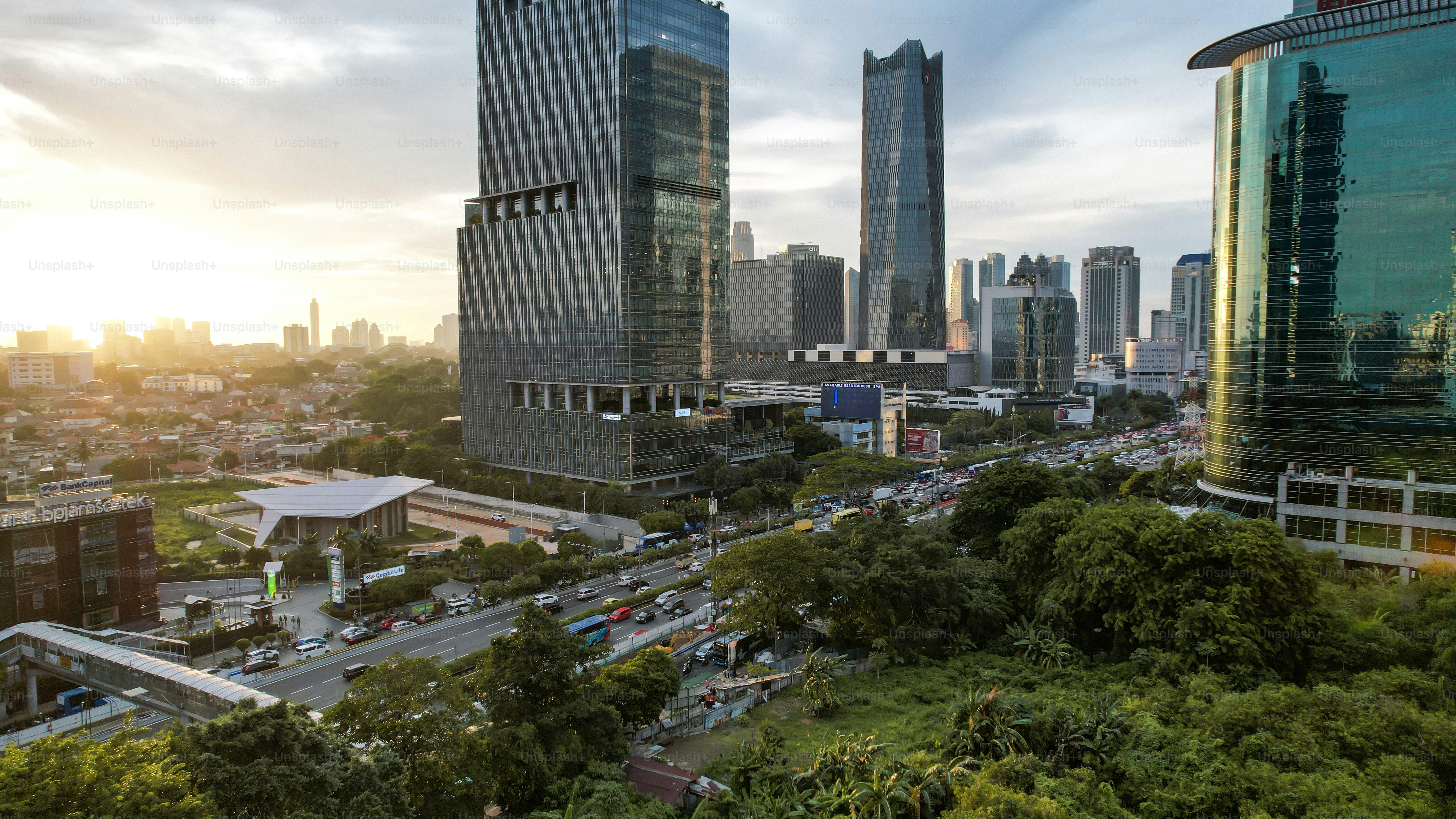 Panoramic cityscape of Indonesia capital city Jakarta at sunset. A rare ...