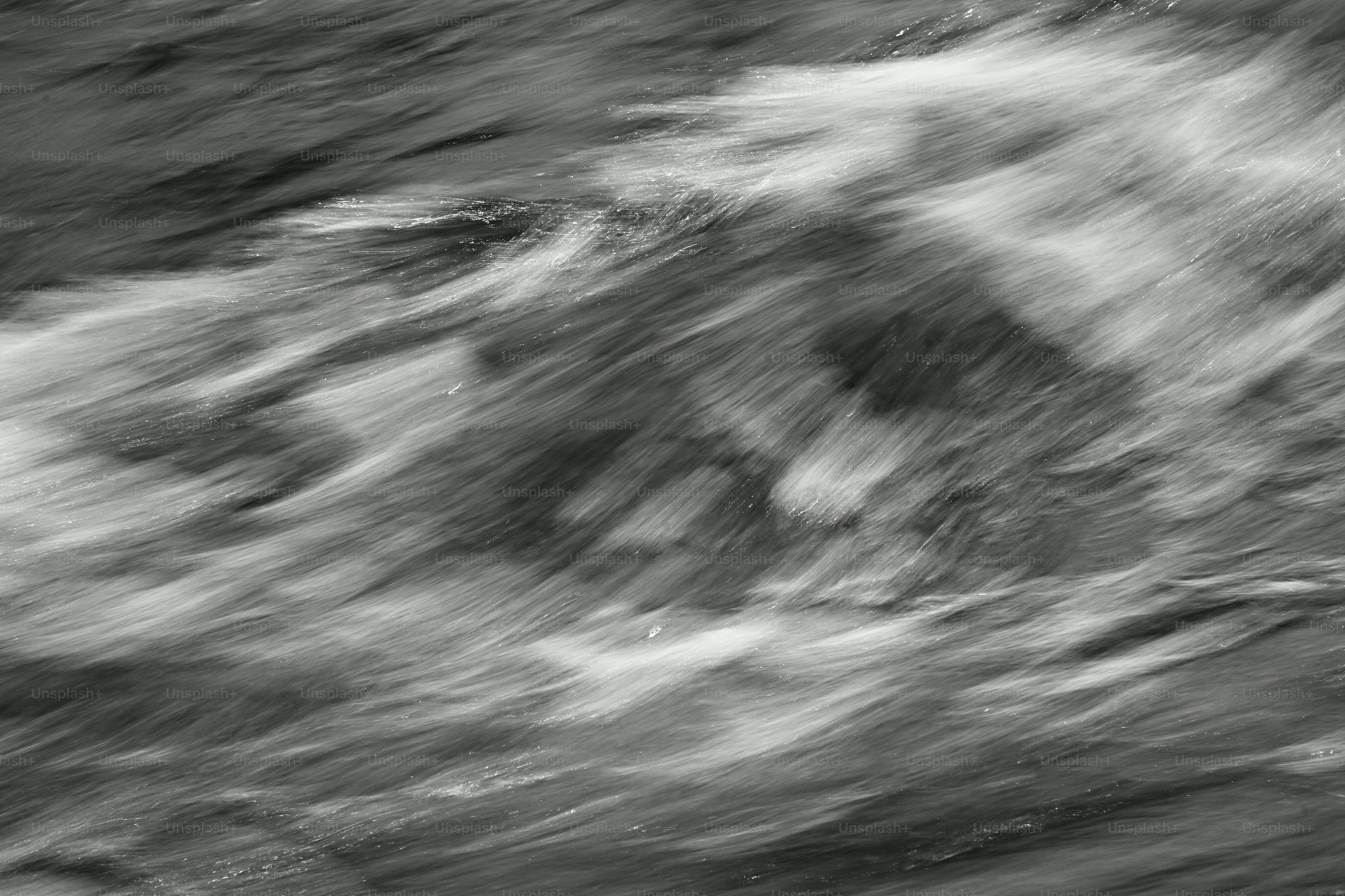River in motion after heavy rain, at slow shutter speed. Black and white photo. photo ...