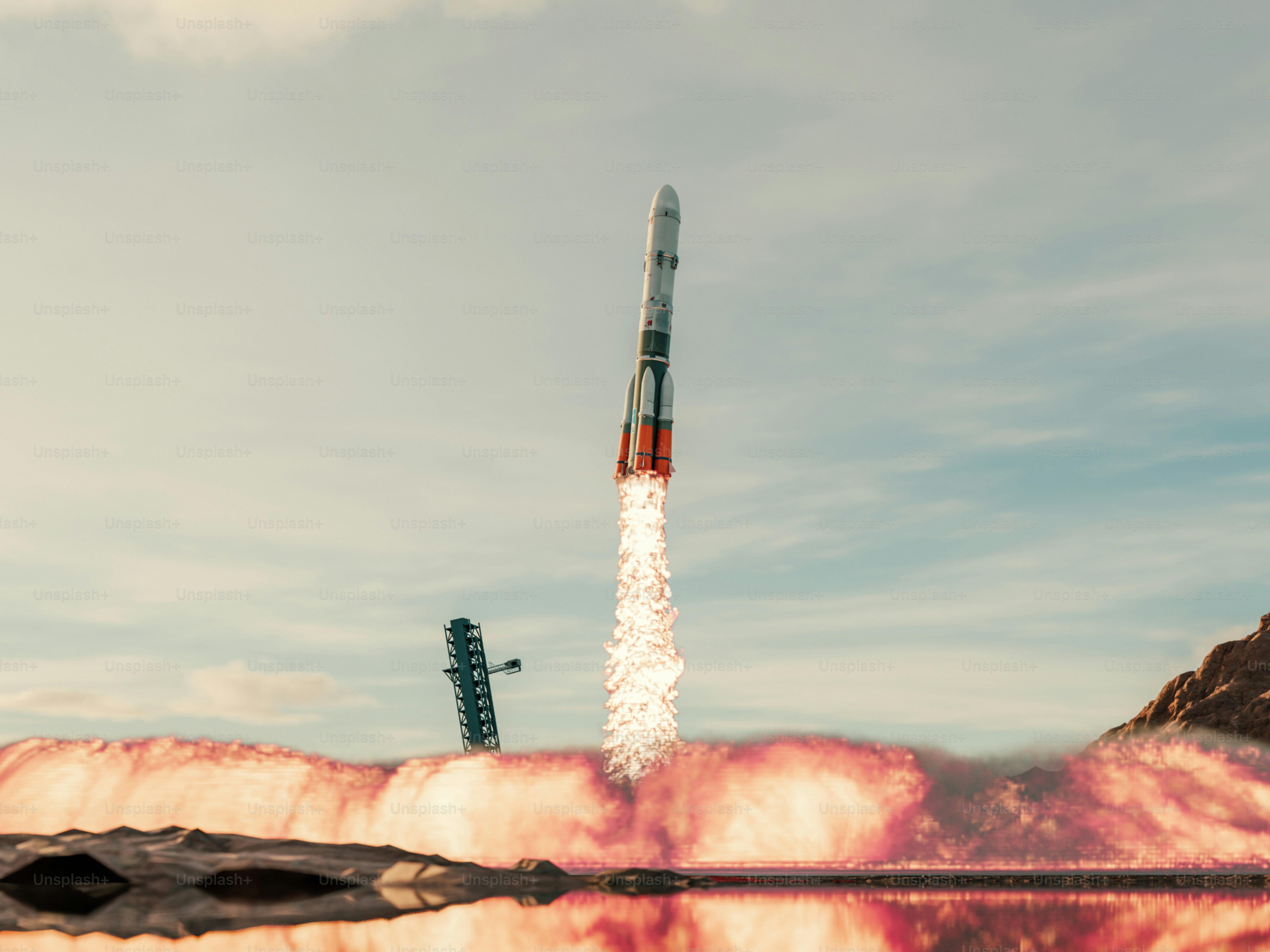 A rocket launching into the sky with a reflection on the ground photo ...