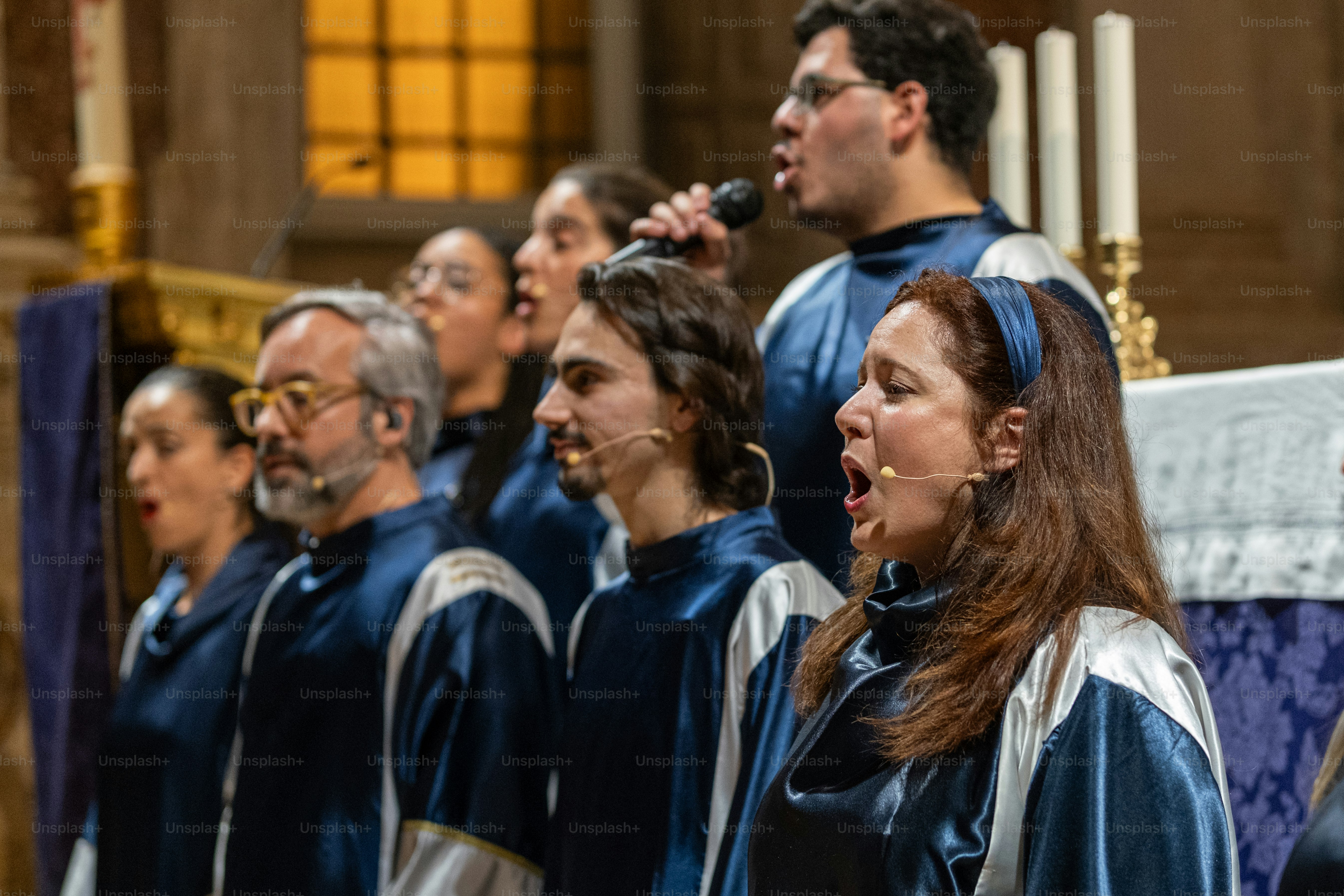A group of people standing next to each other photo – Singing Image on ...