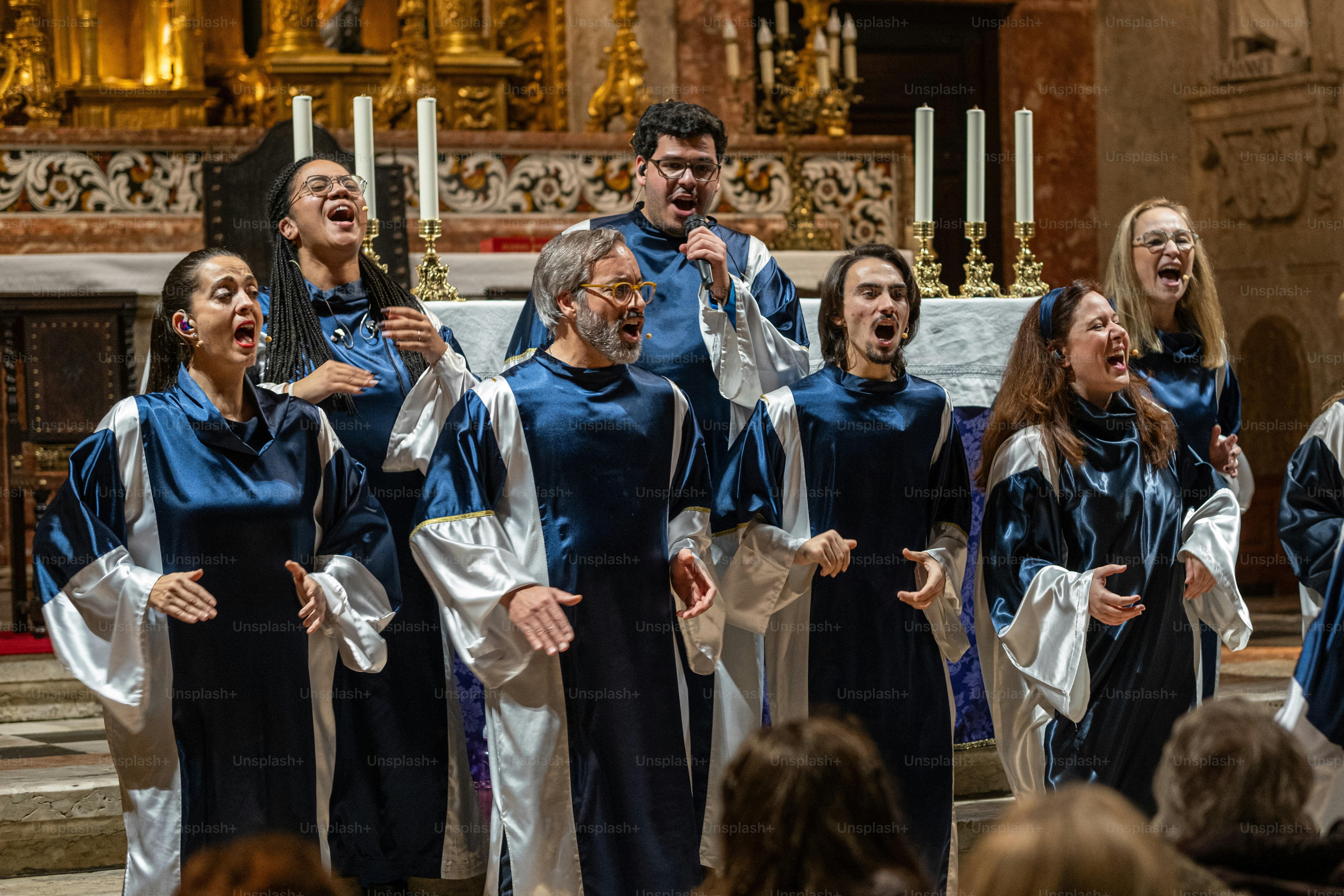 A group of people that are standing in front of a church photo – Singer ...
