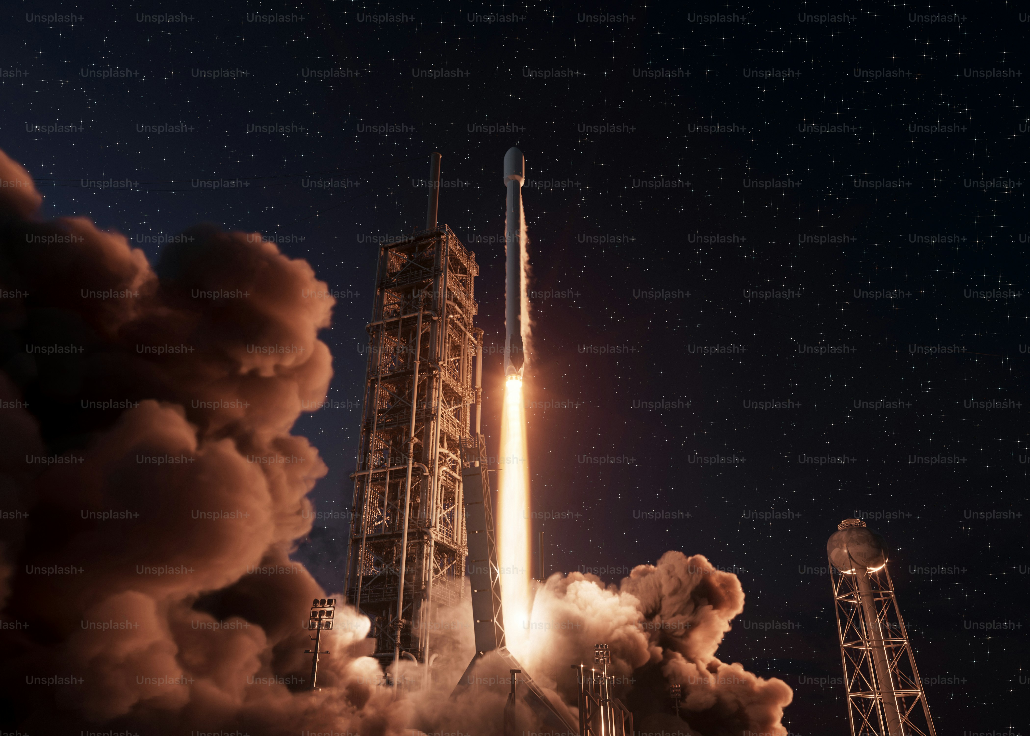 A rocket launching into the sky with a sunset in the background photo ...
