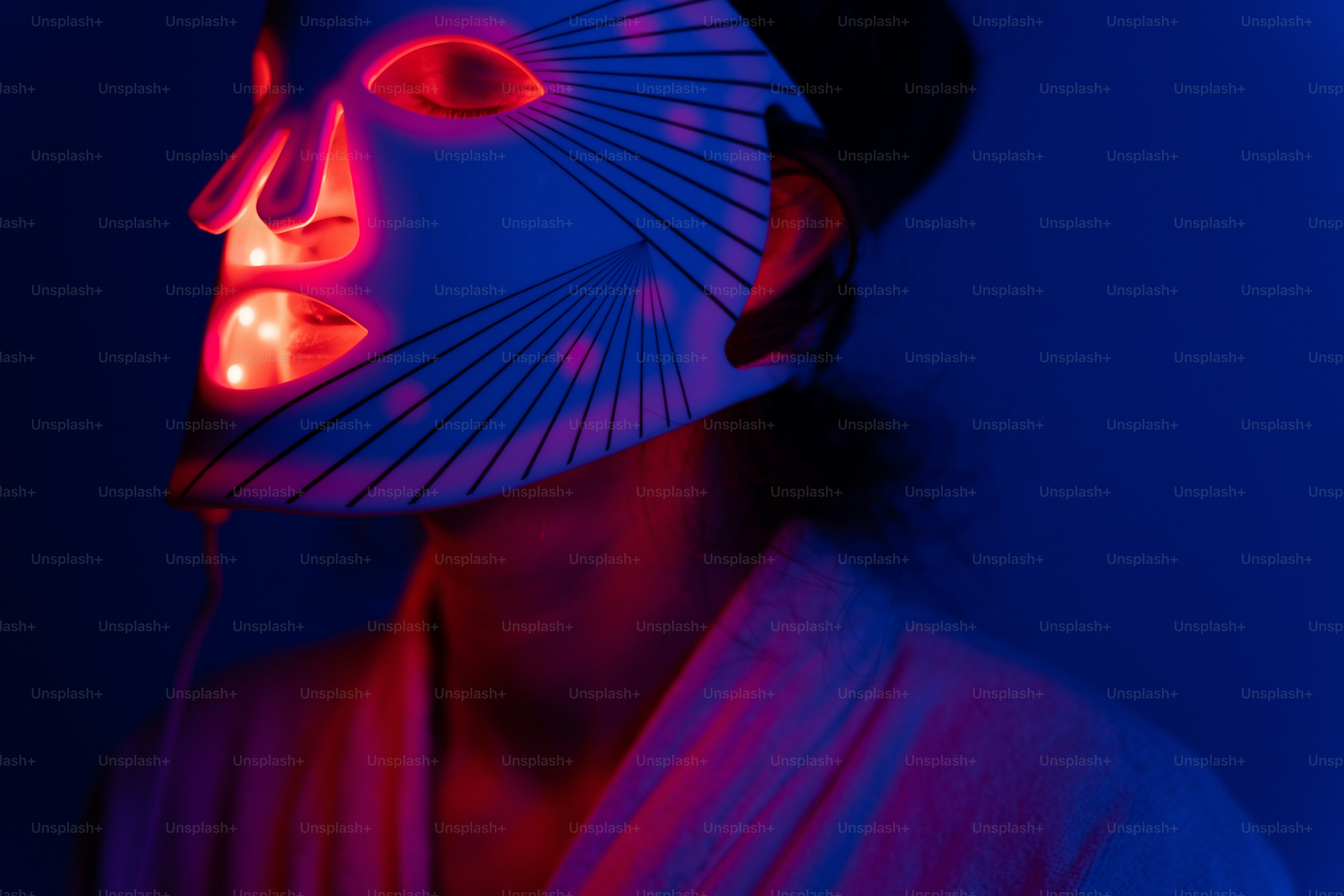 A man with a mask on his face photo – Led mask Image on Unsplash