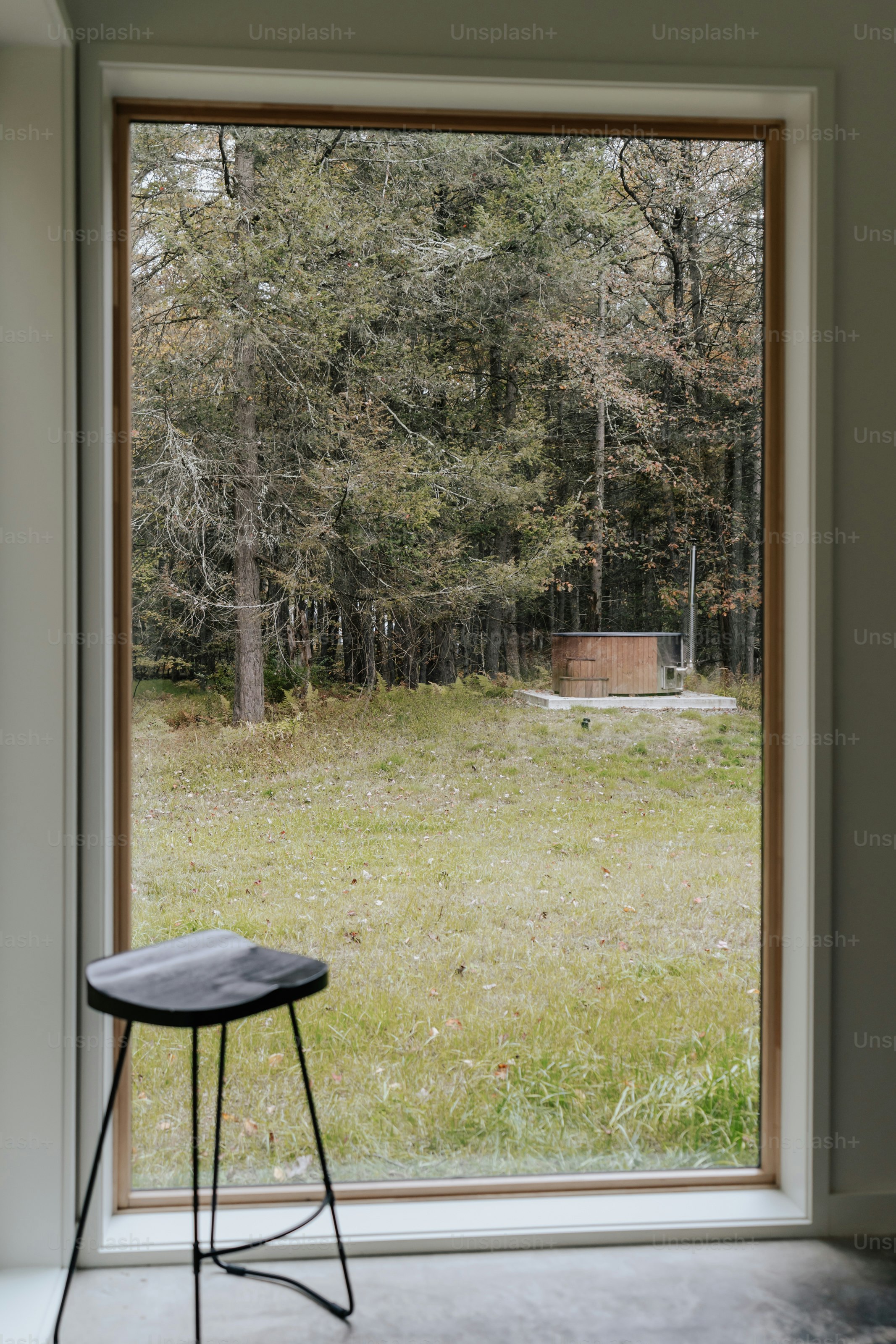 A small stool sitting in front of a window photo – House Image on Unsplash