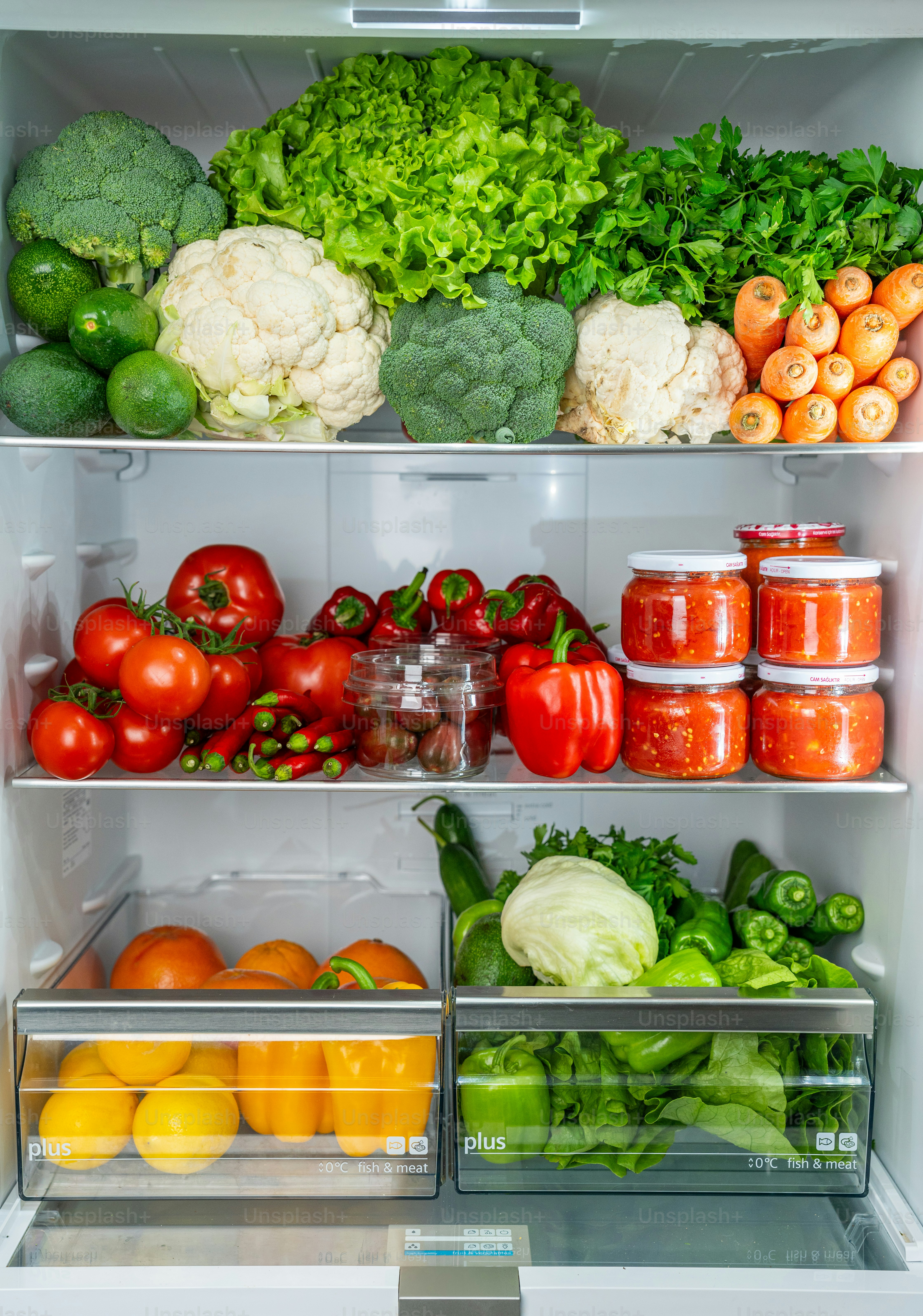 A refrigerator filled with lots of different types of vegetables photo ...