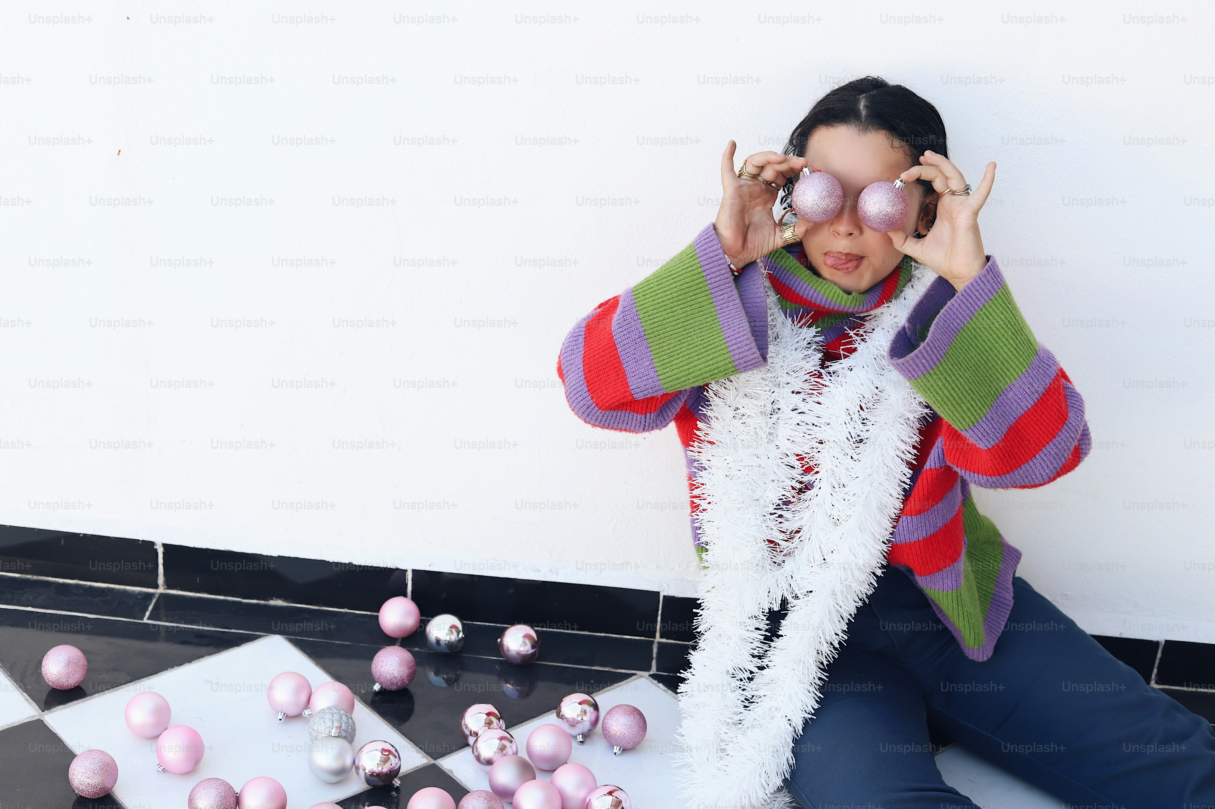 A woman sitting on the floor with balls in front of her photo – Model ...