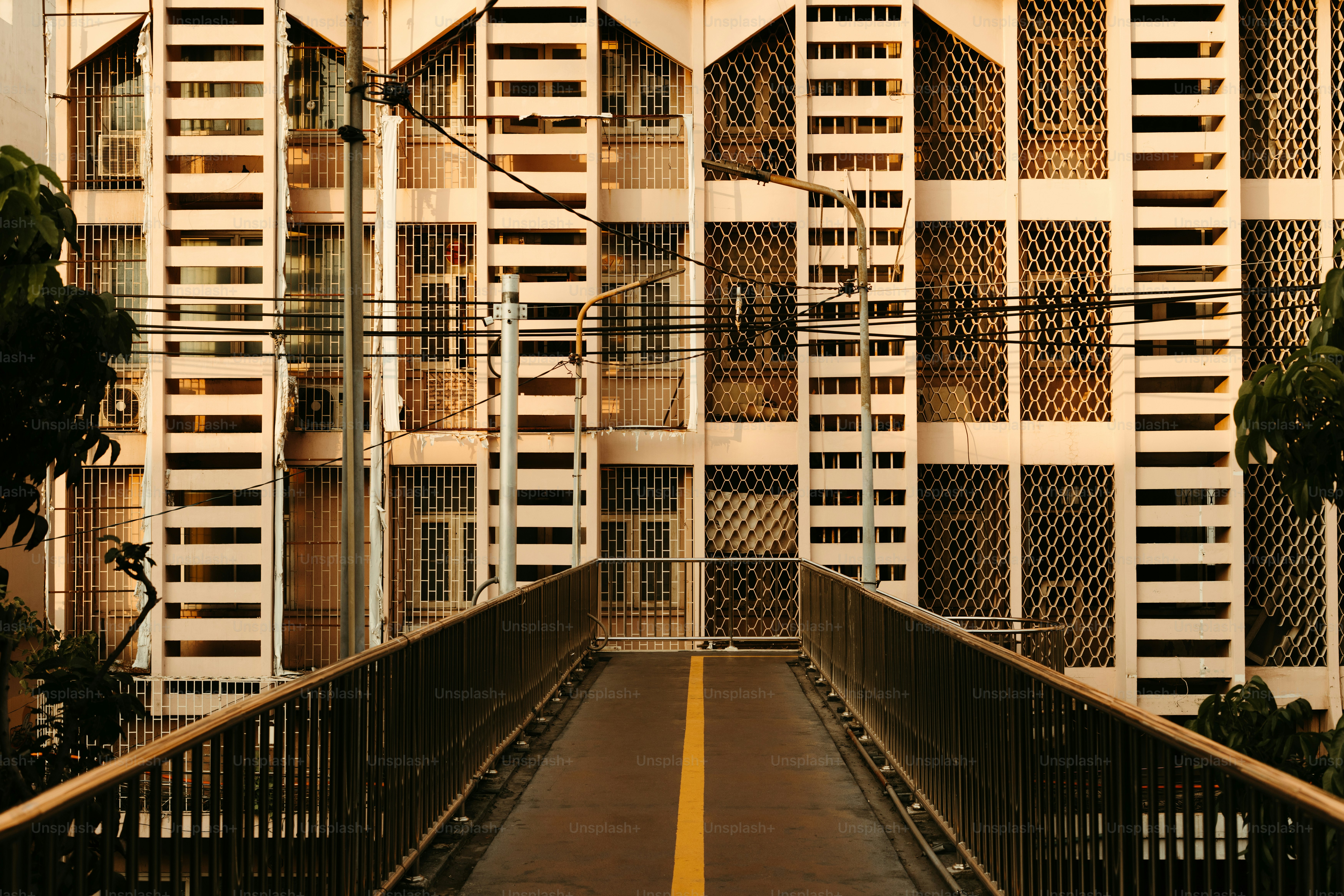 A bridge with a yellow line going across it photo – Bangkok Image on ...