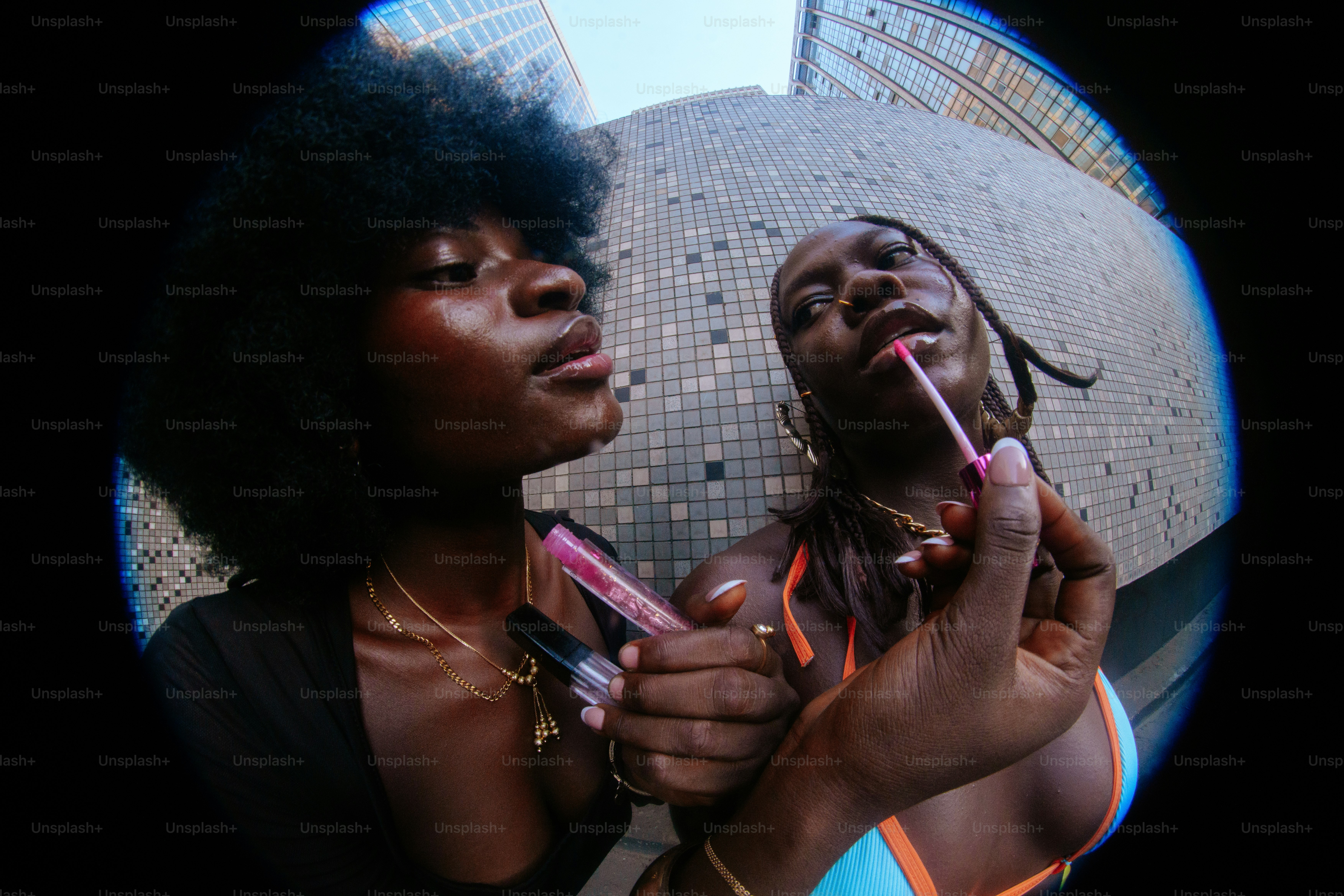 A woman brushing her teeth next to another woman photo – Fashion Image ...