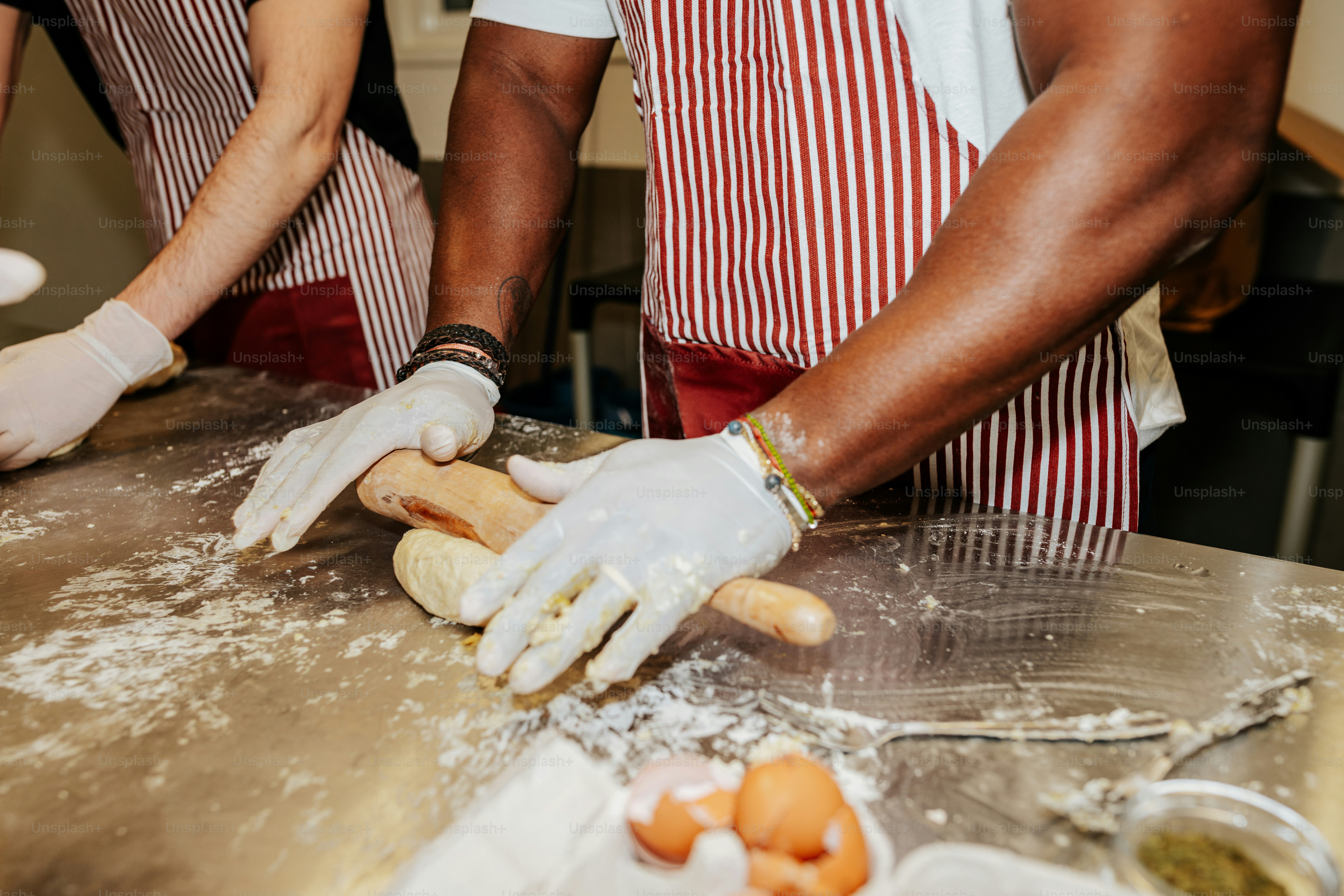 A group of people preparing food on a table photo – Food Image on Unsplash