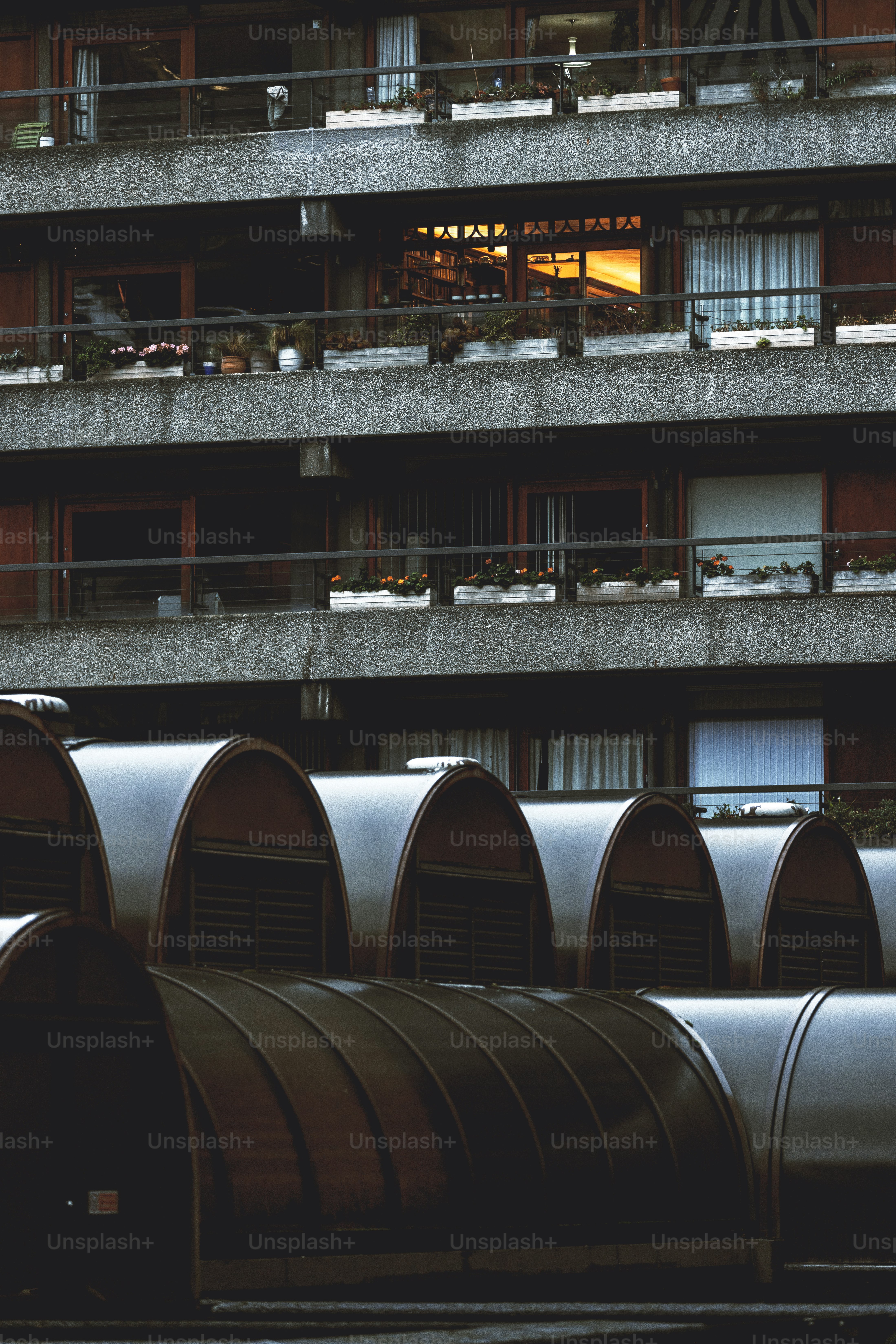 A row of mail boxes in front of a building photo – Barbican Image on ...