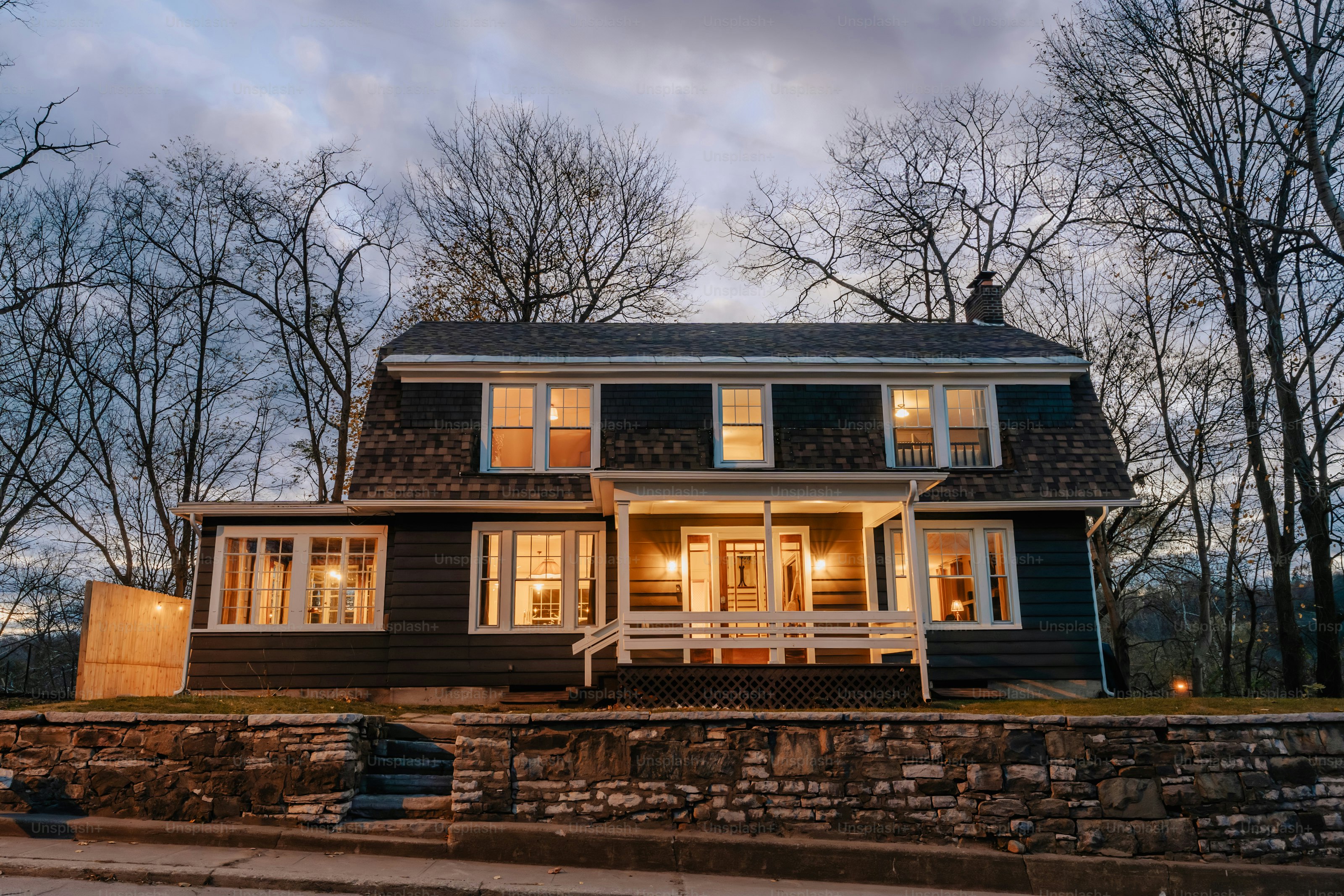A house is lit up at night with lights on photo – Building Image on ...