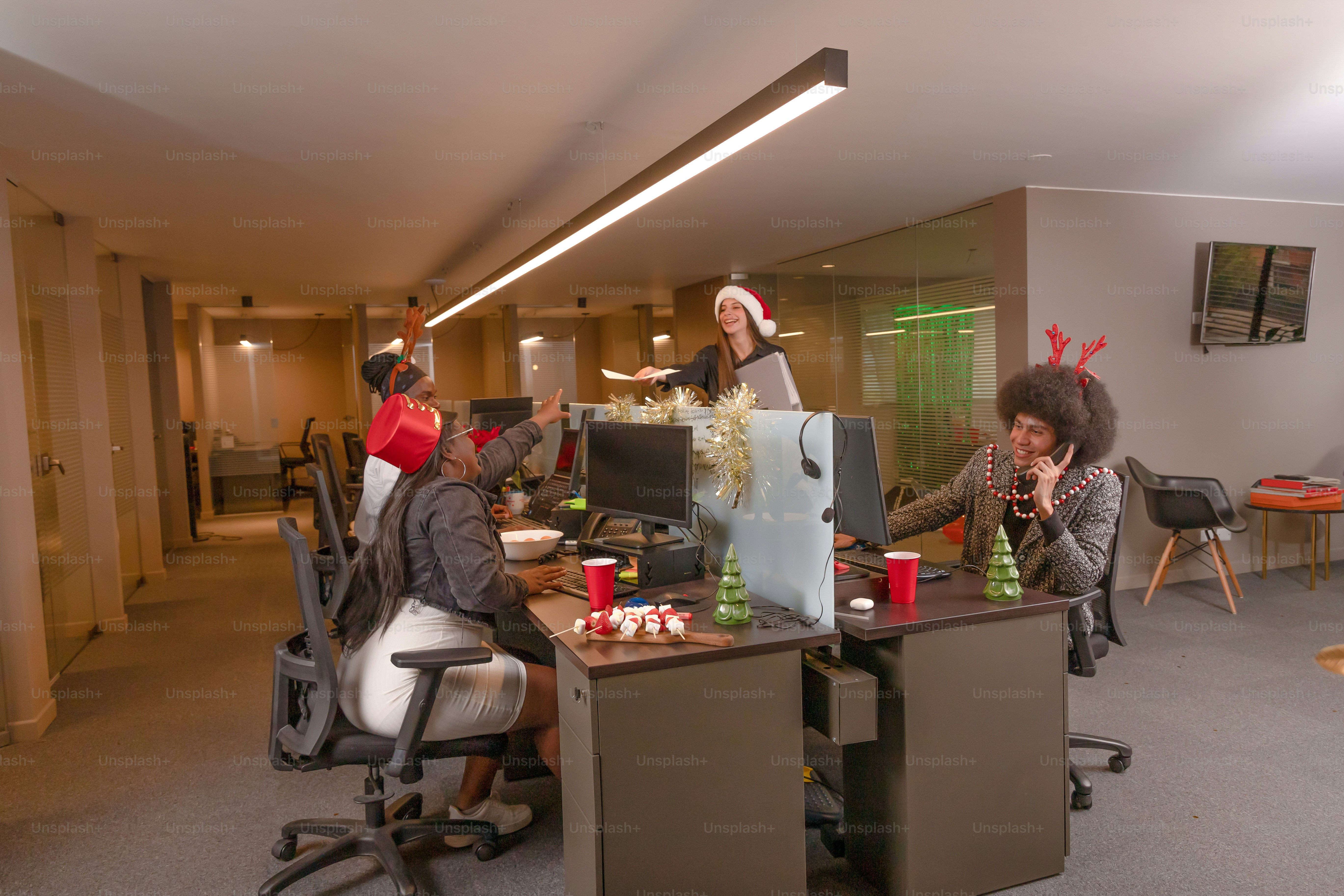 A group of people sitting at desks in an office photo – Party Image on ...