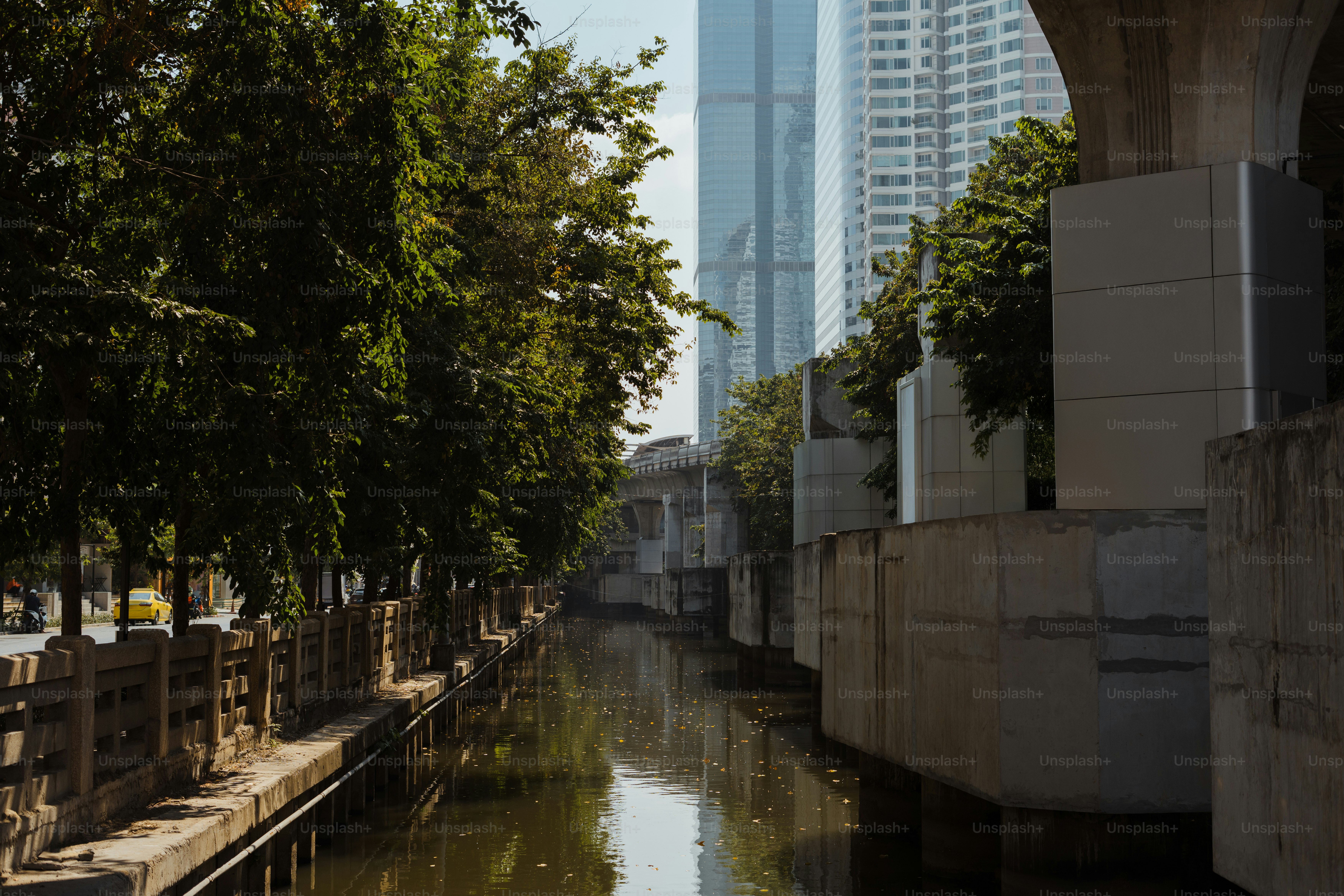 A river running through a city next to tall buildings photo – Bangkok ...