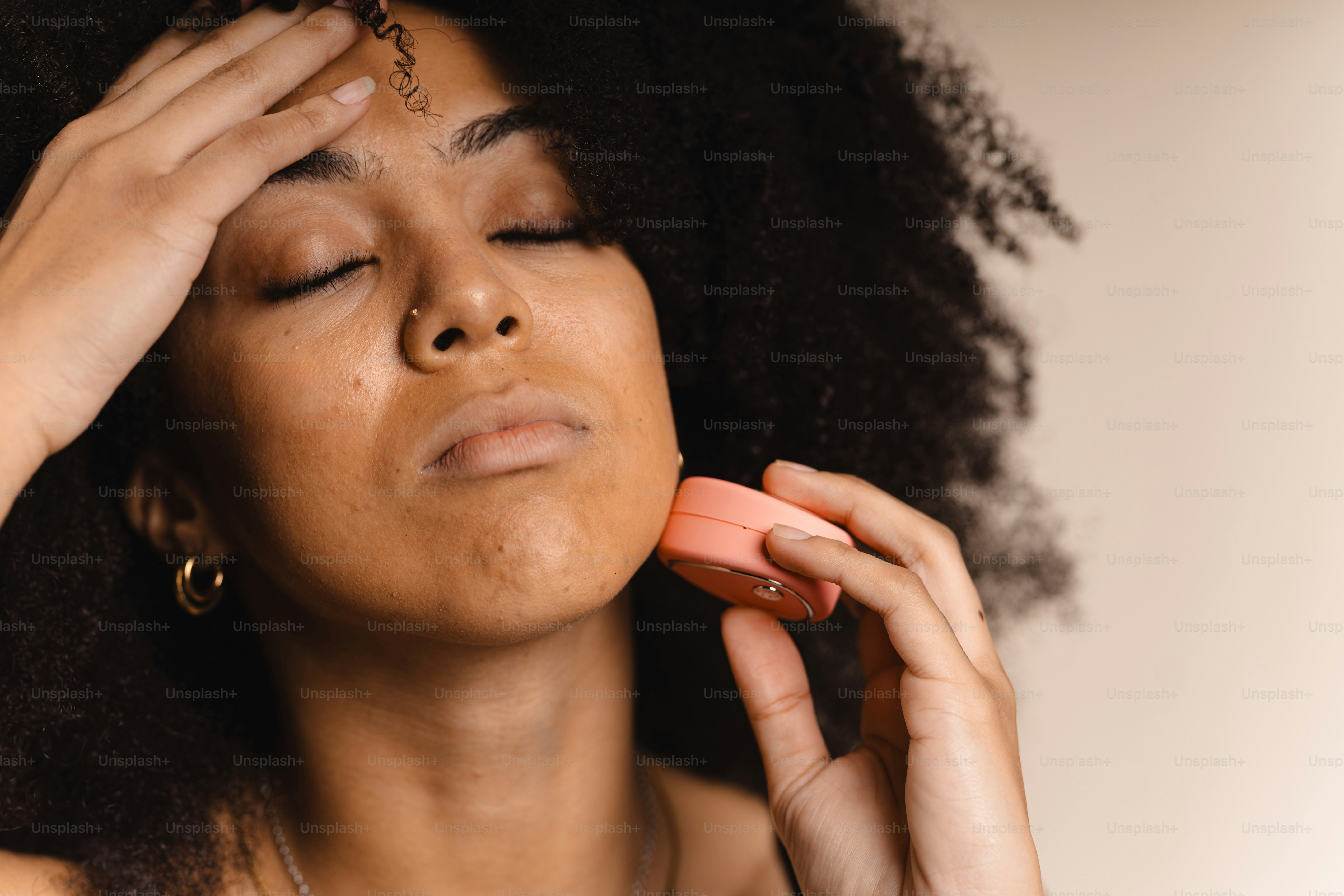 A woman holding a cell phone to her ear photo – Beauty Image on Unsplash