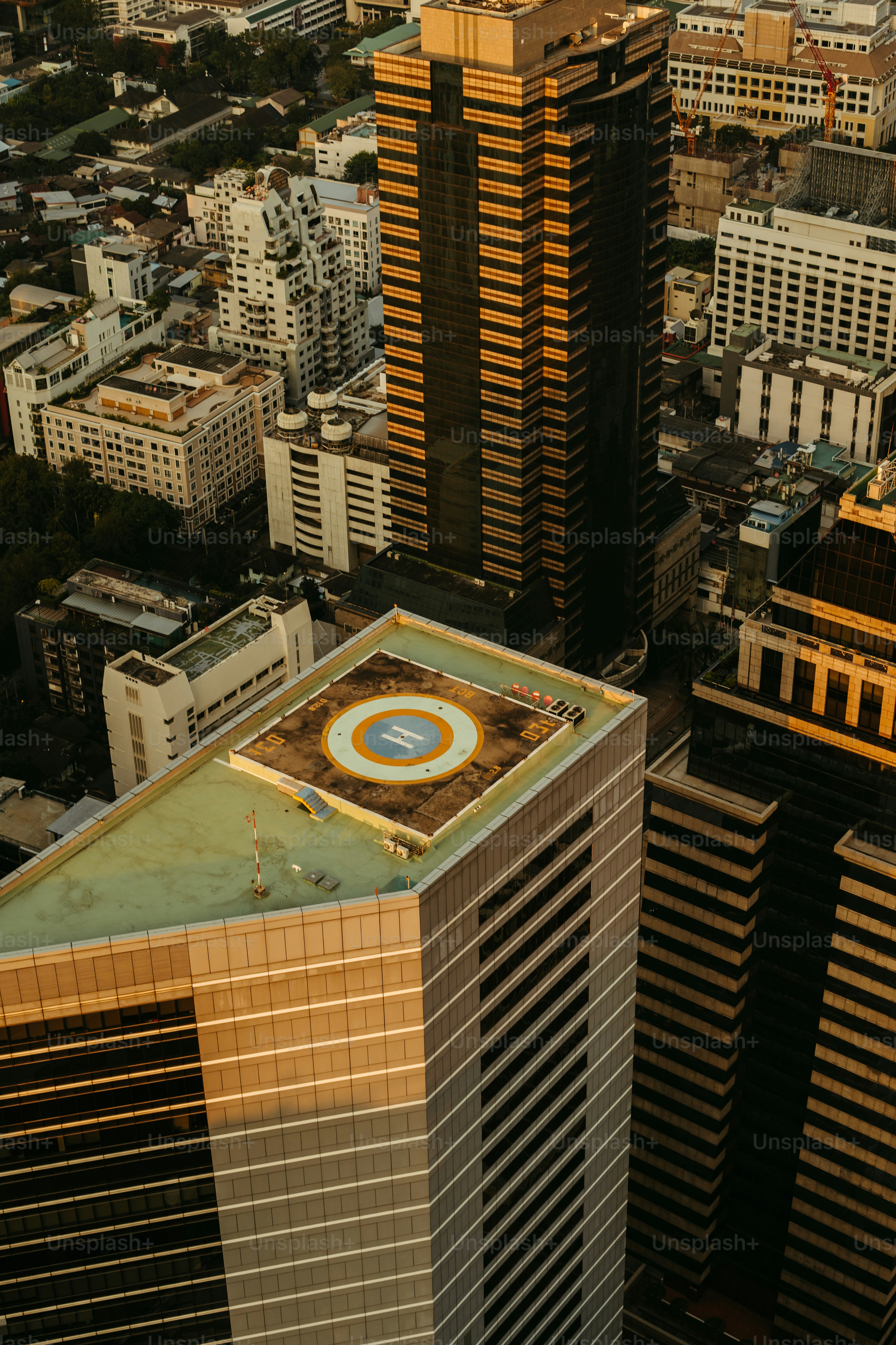 An aerial view of a city with tall buildings photo – Bangkok Image on ...