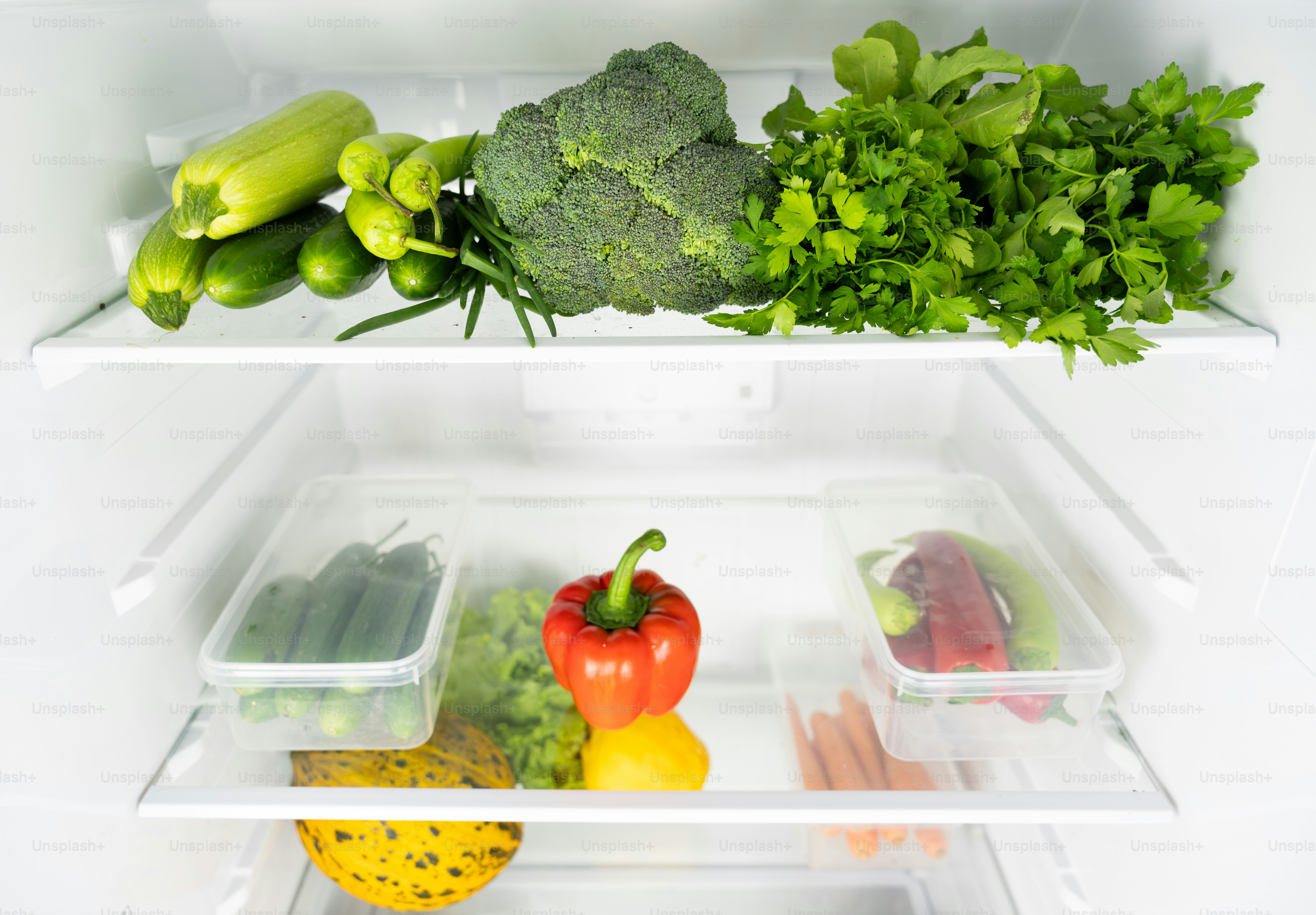 A refrigerator filled with lots of different types of vegetables photo ...