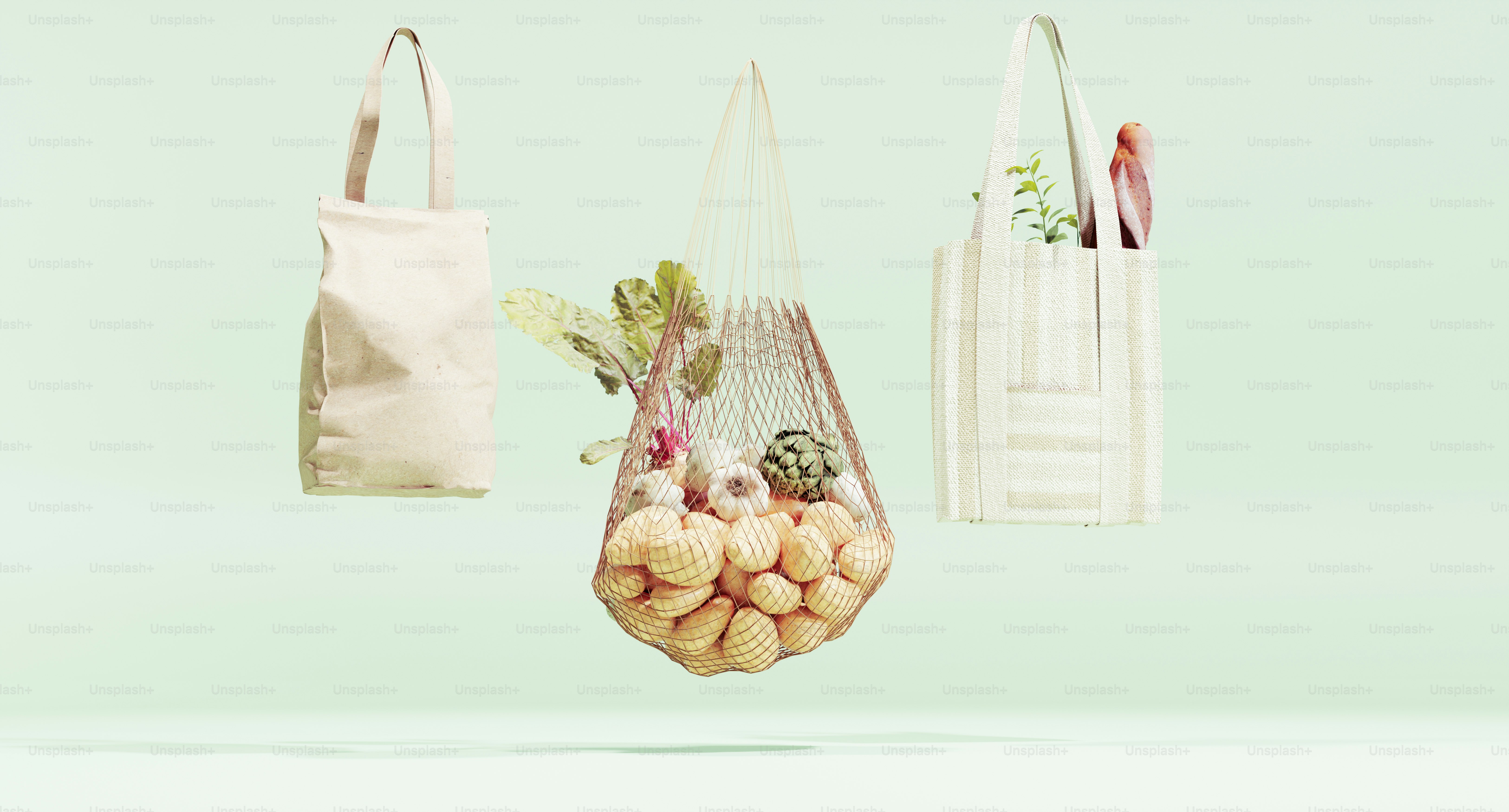 Un grupo de tres bolsas colgando de una cuerda foto – Imagen de Papel en Unsplash