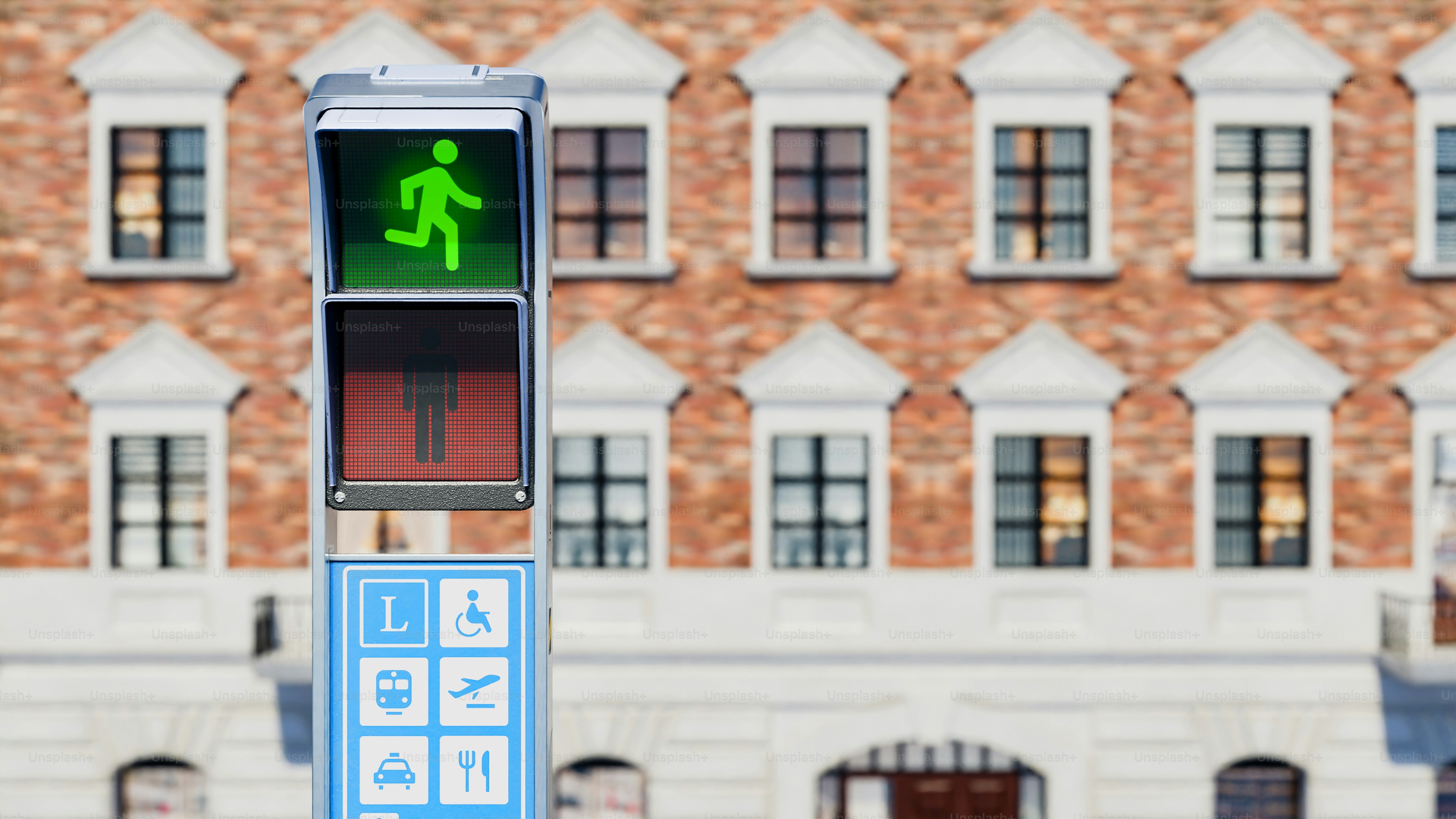 A street sign in front of a brick building photo – Traffic lights Image ...