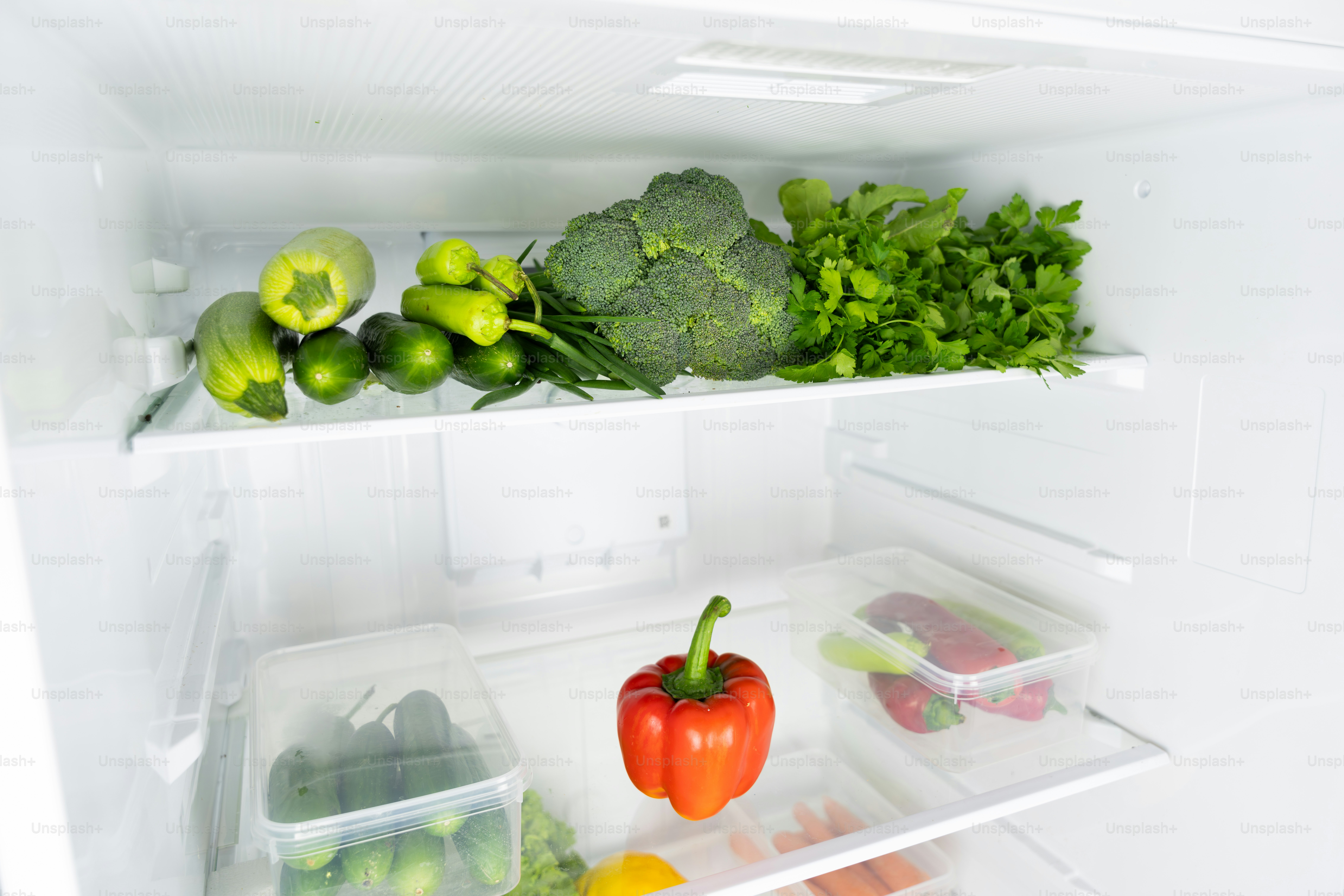 A refrigerator filled with lots of different types of vegetables photo ...