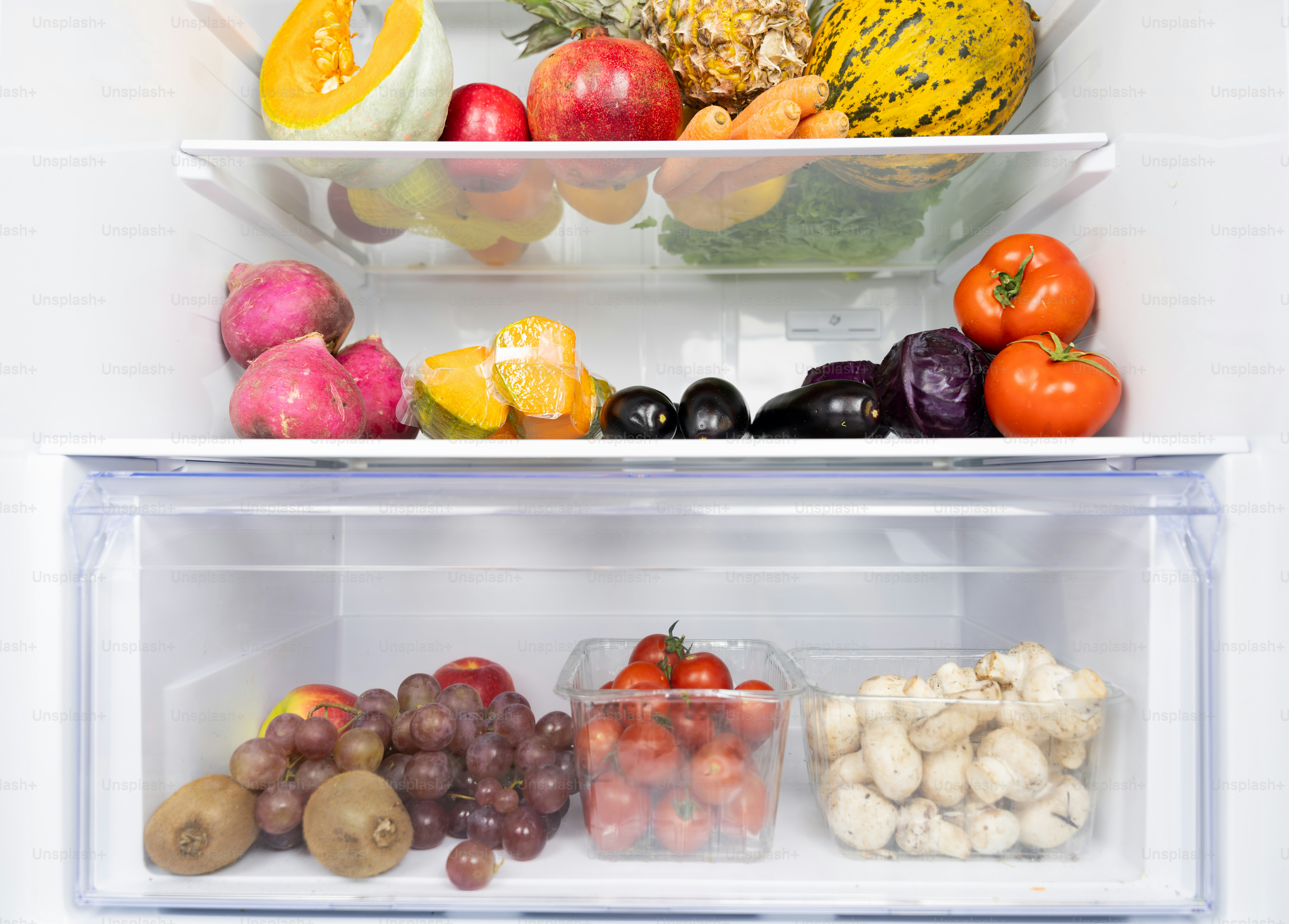 A refrigerator filled with lots of different types of food photo – In ...