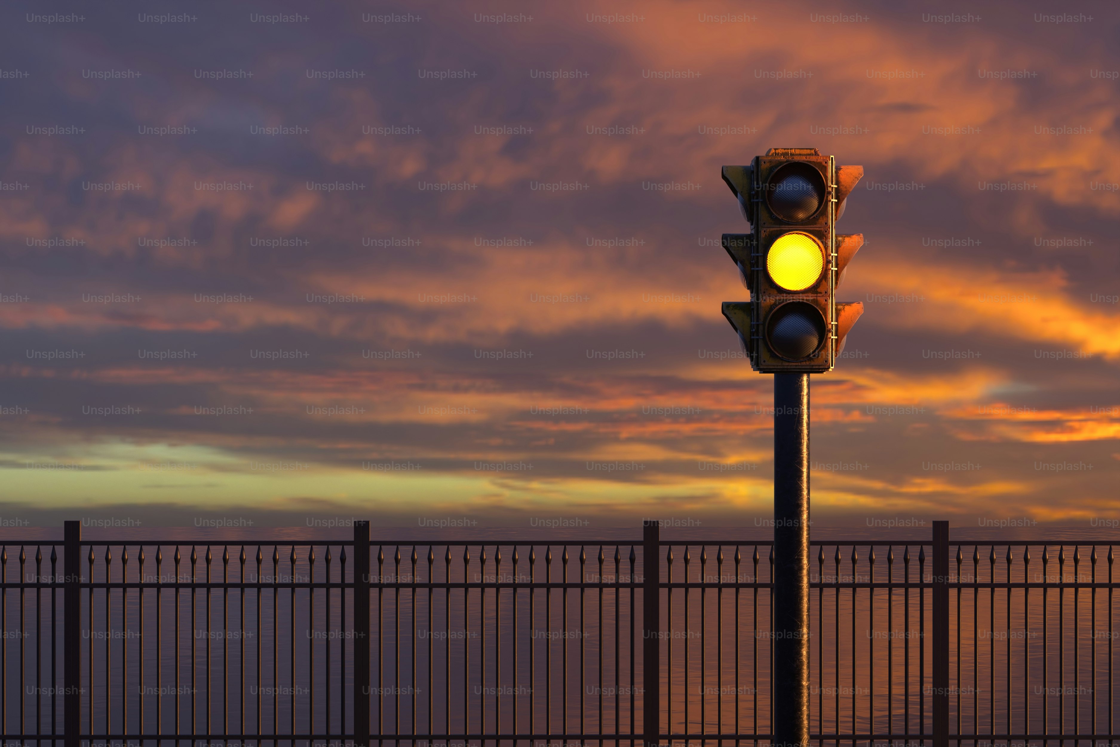 A traffic light sitting next to a tall fence photo – Traffic light ...