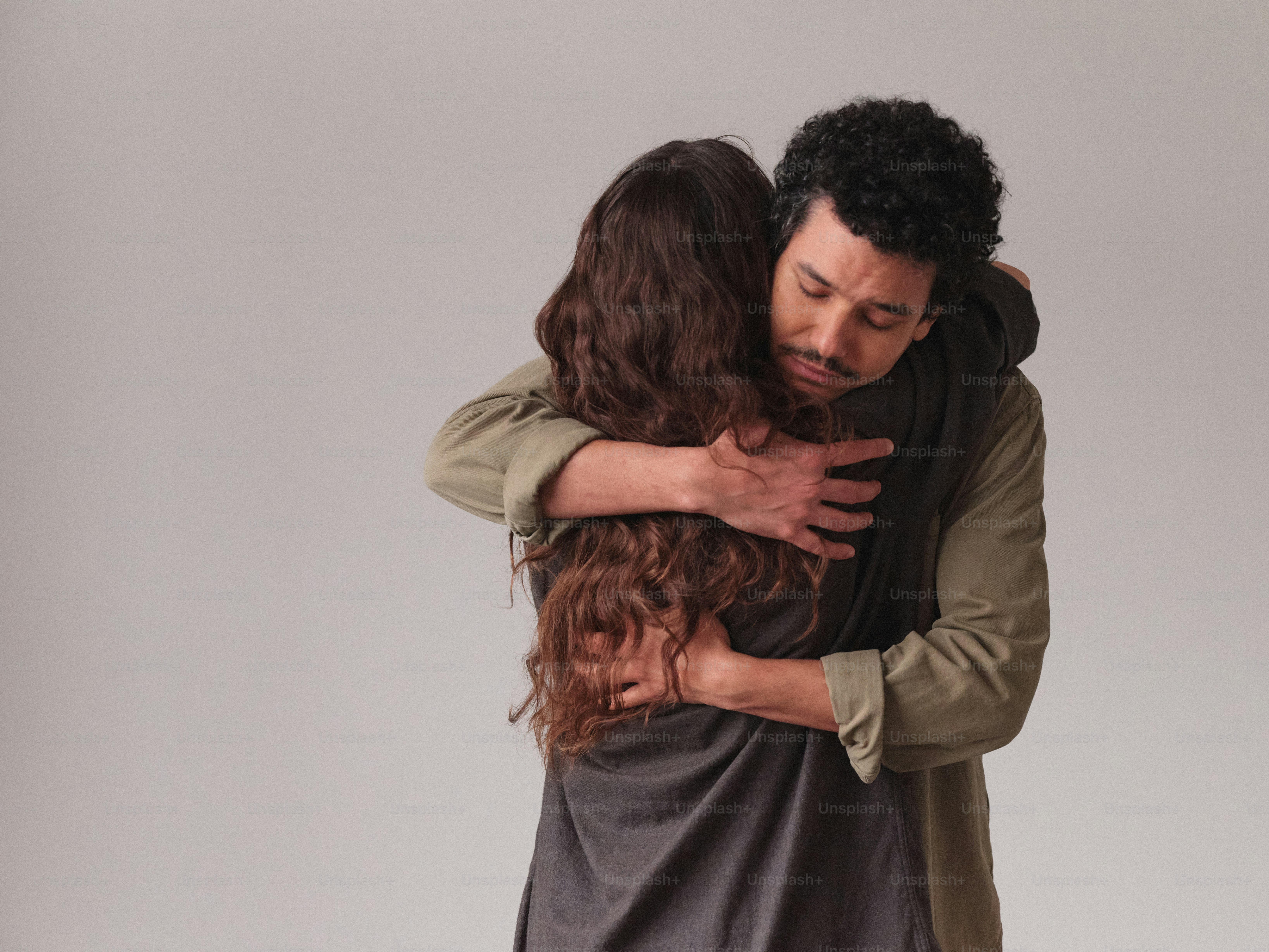 A couple of people that are hugging each other photo – Comfort Image on ...