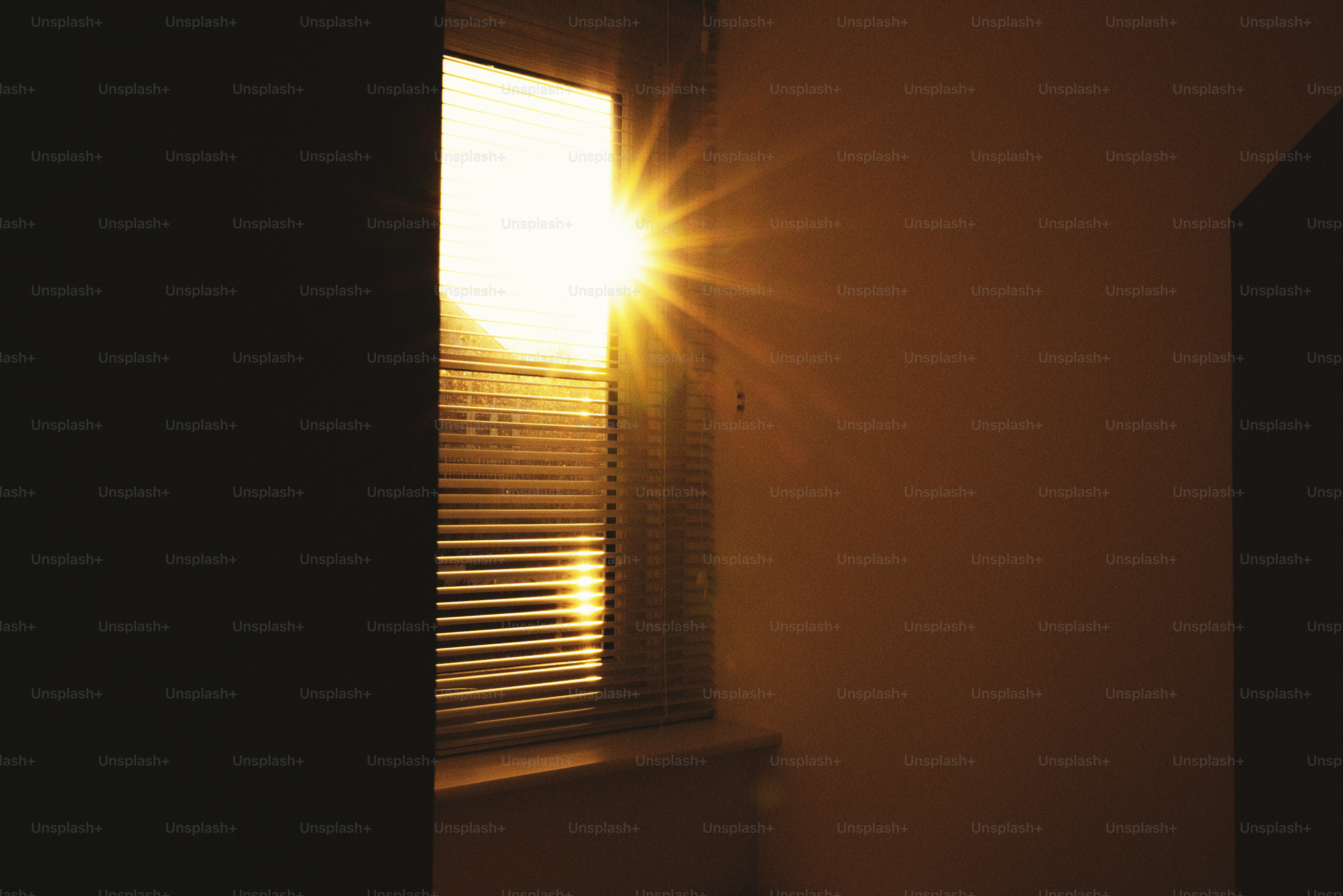 The sun shining through a window in a room photo – Golden hour Image on ...