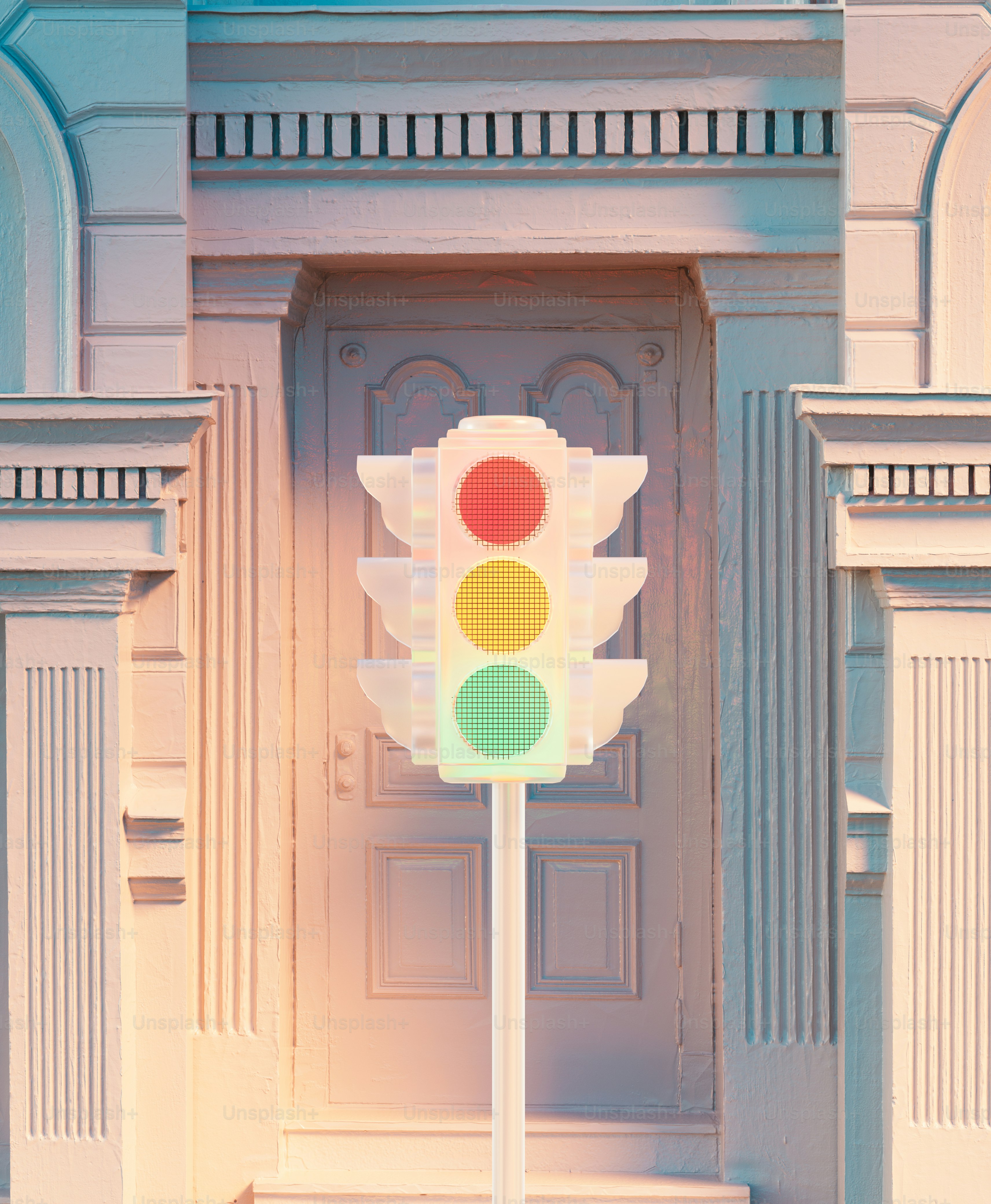 A traffic light sitting in front of a building photo – Traffic lights ...