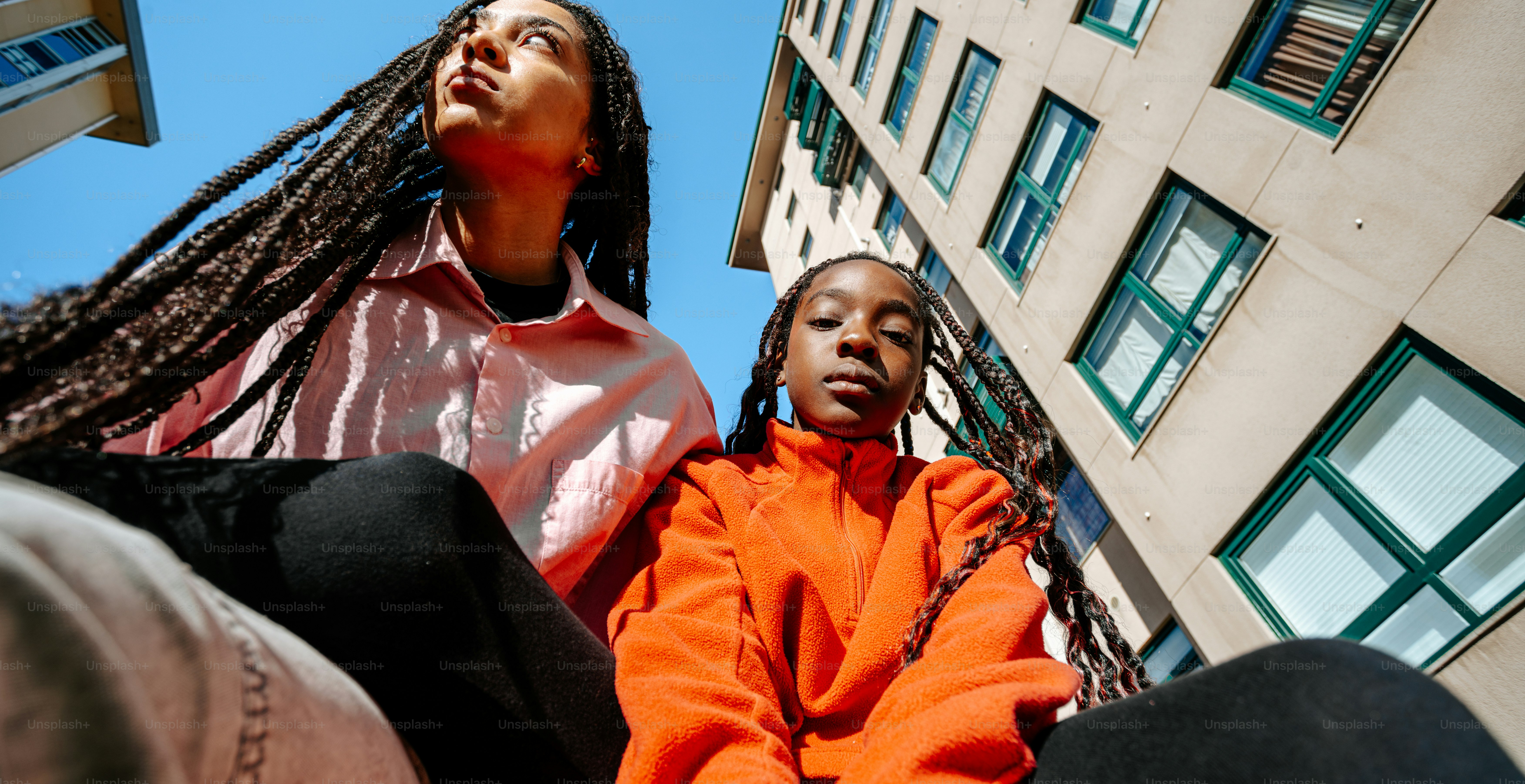 A couple of people that are sitting down photo – Distorted view Image ...