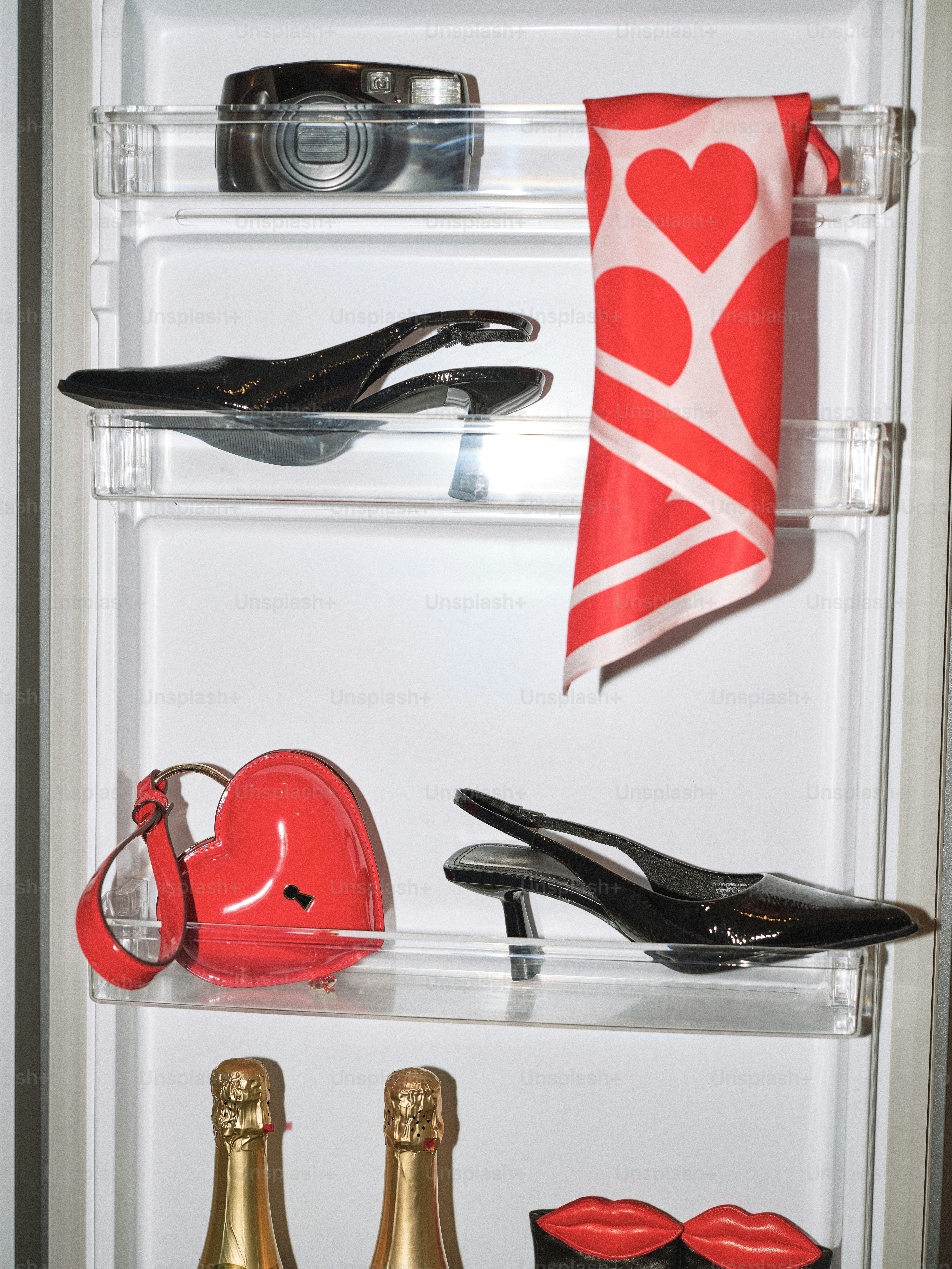 A refrigerator filled with lots of different types of shoes photo ...