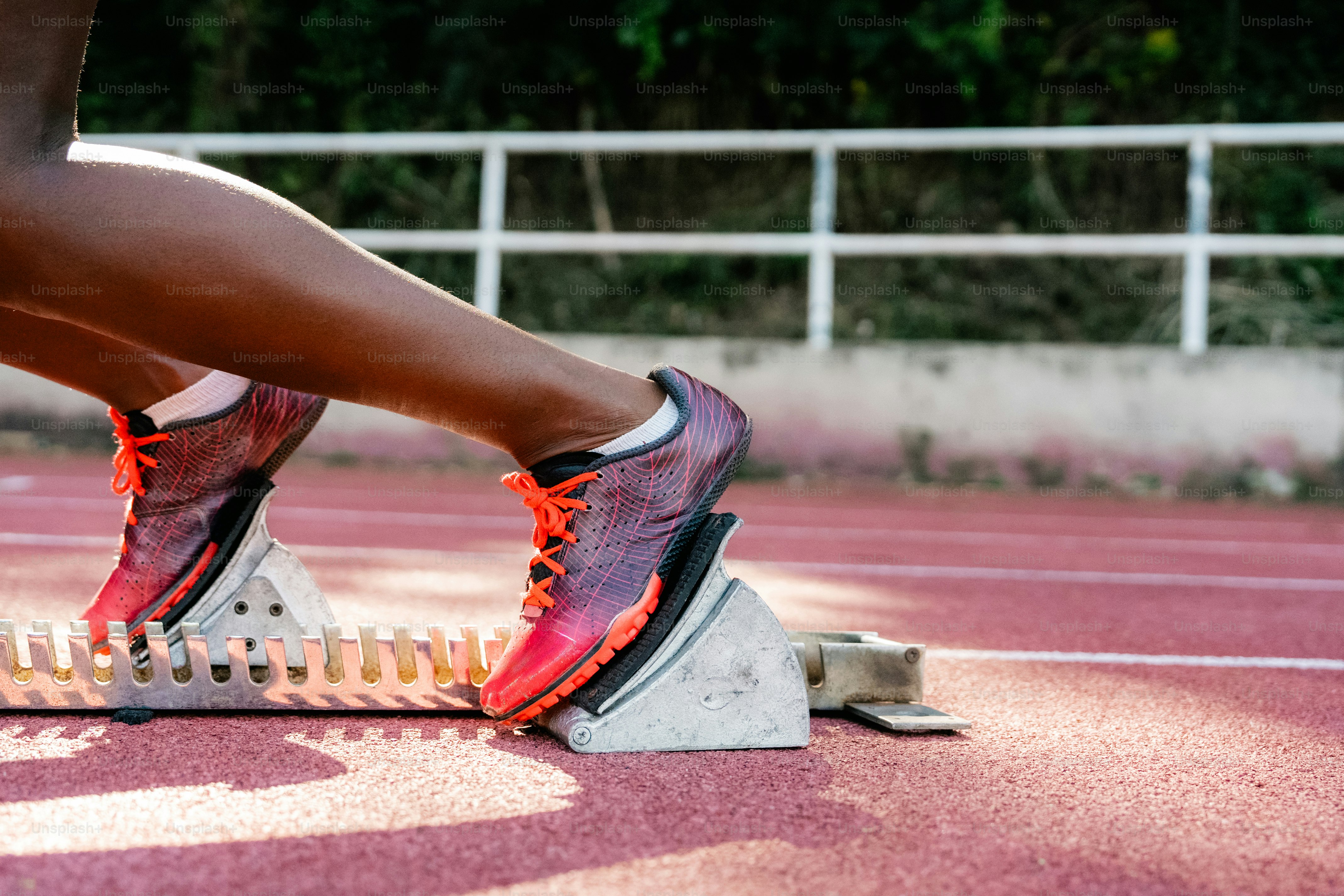 A close up of a person running on a track photo – Running Image on Unsplash