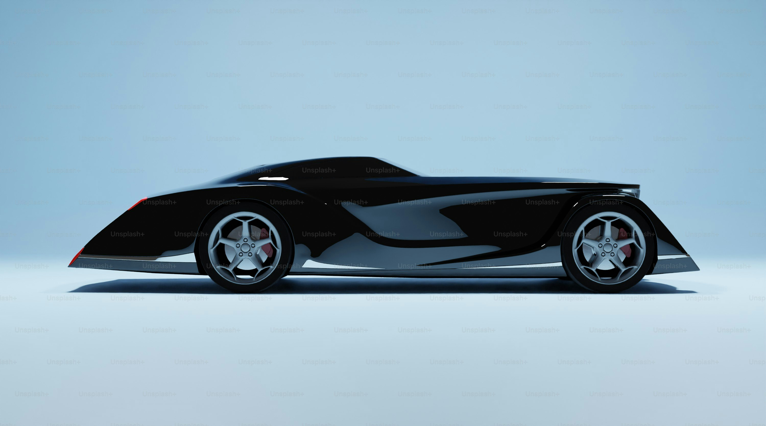 Foto Sebuah mobil sport hitam ditampilkan dengan latar belakang putih ...