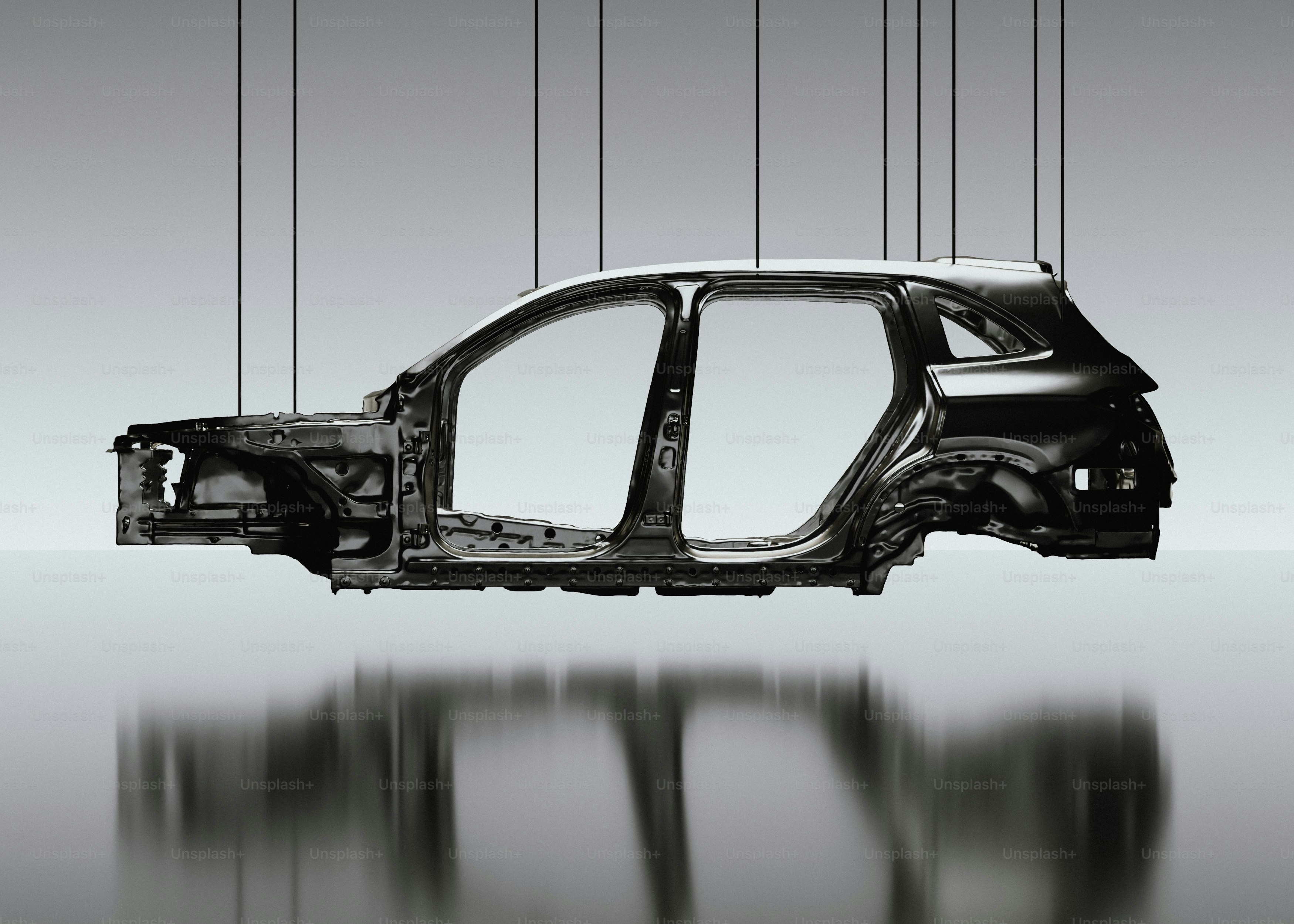 A car that is being suspended by strings photo – Car Image on Unsplash