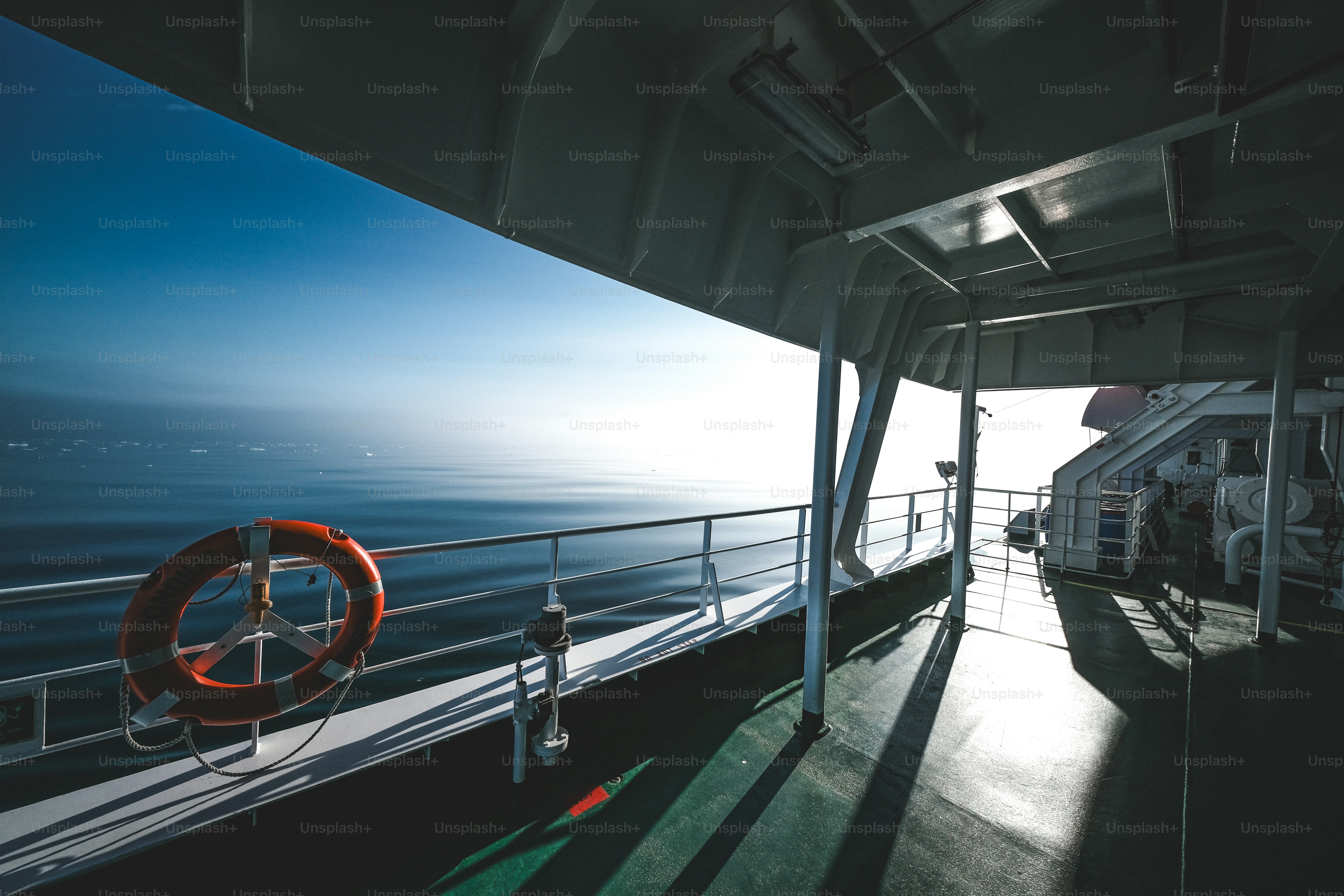 A view of the deck of a ship looking out at the ocean photo – Life ...