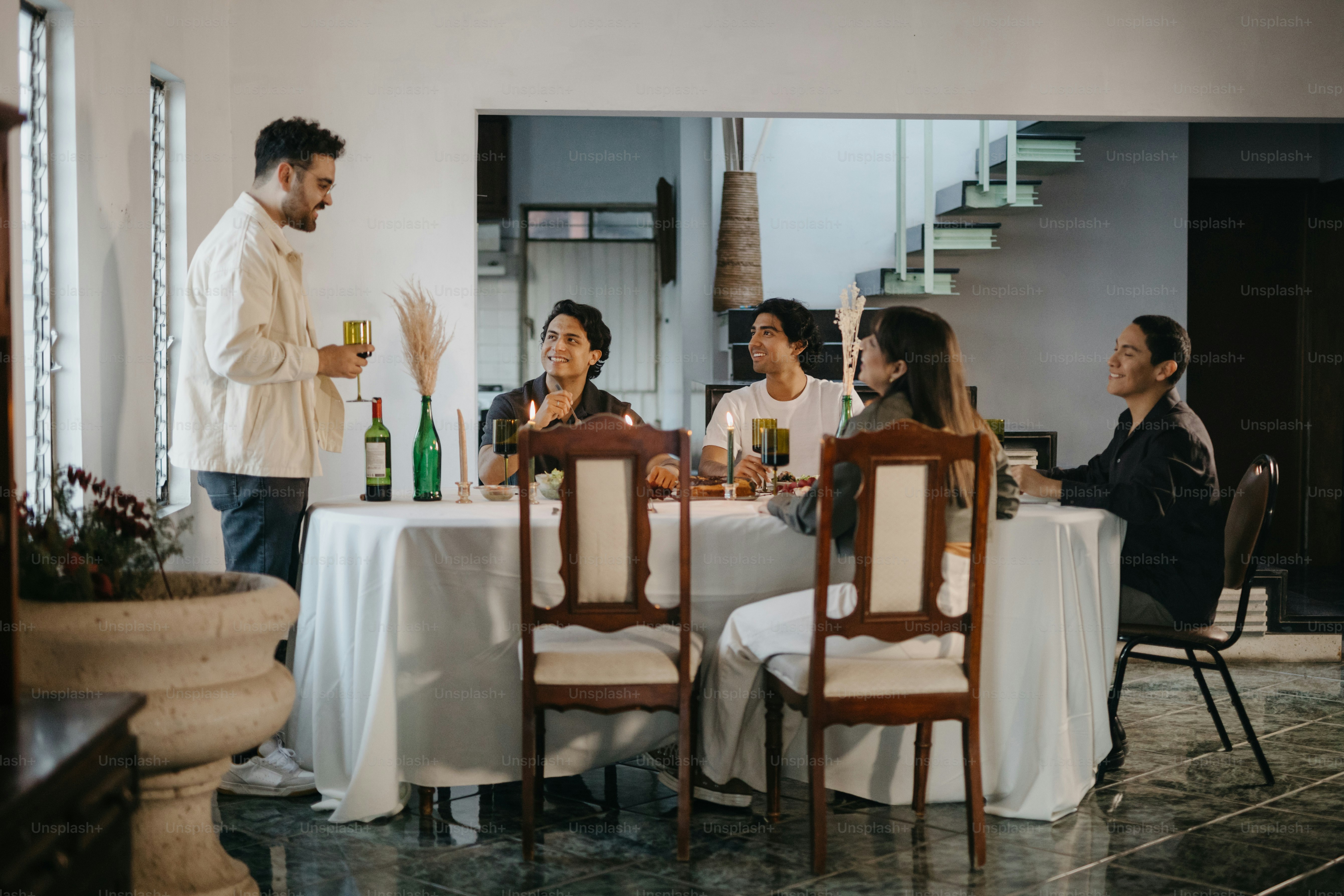 A group of people sitting around a table photo – Food Image on Unsplash