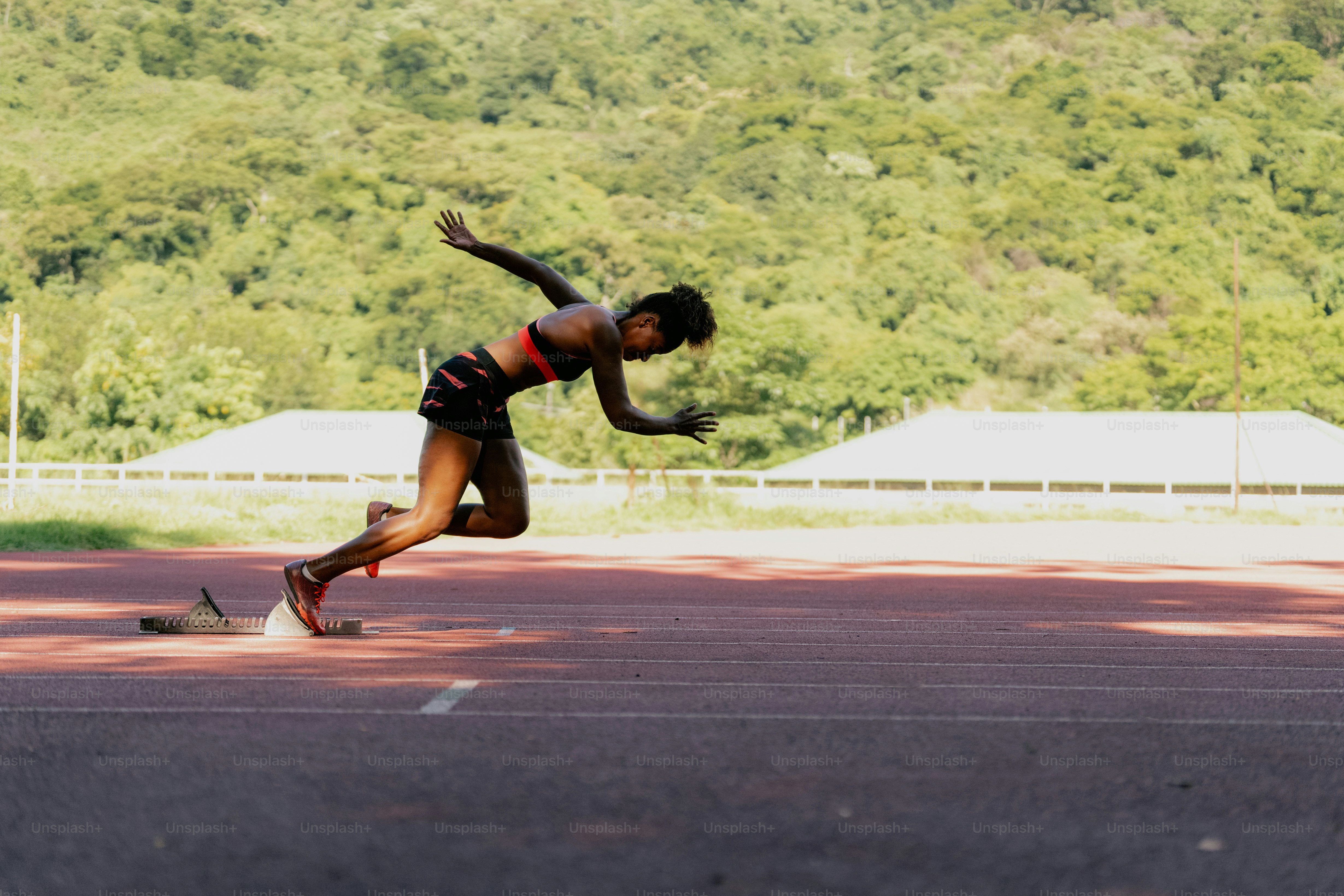 A woman is doing a trick on a skateboard photo – Running Image on Unsplash
