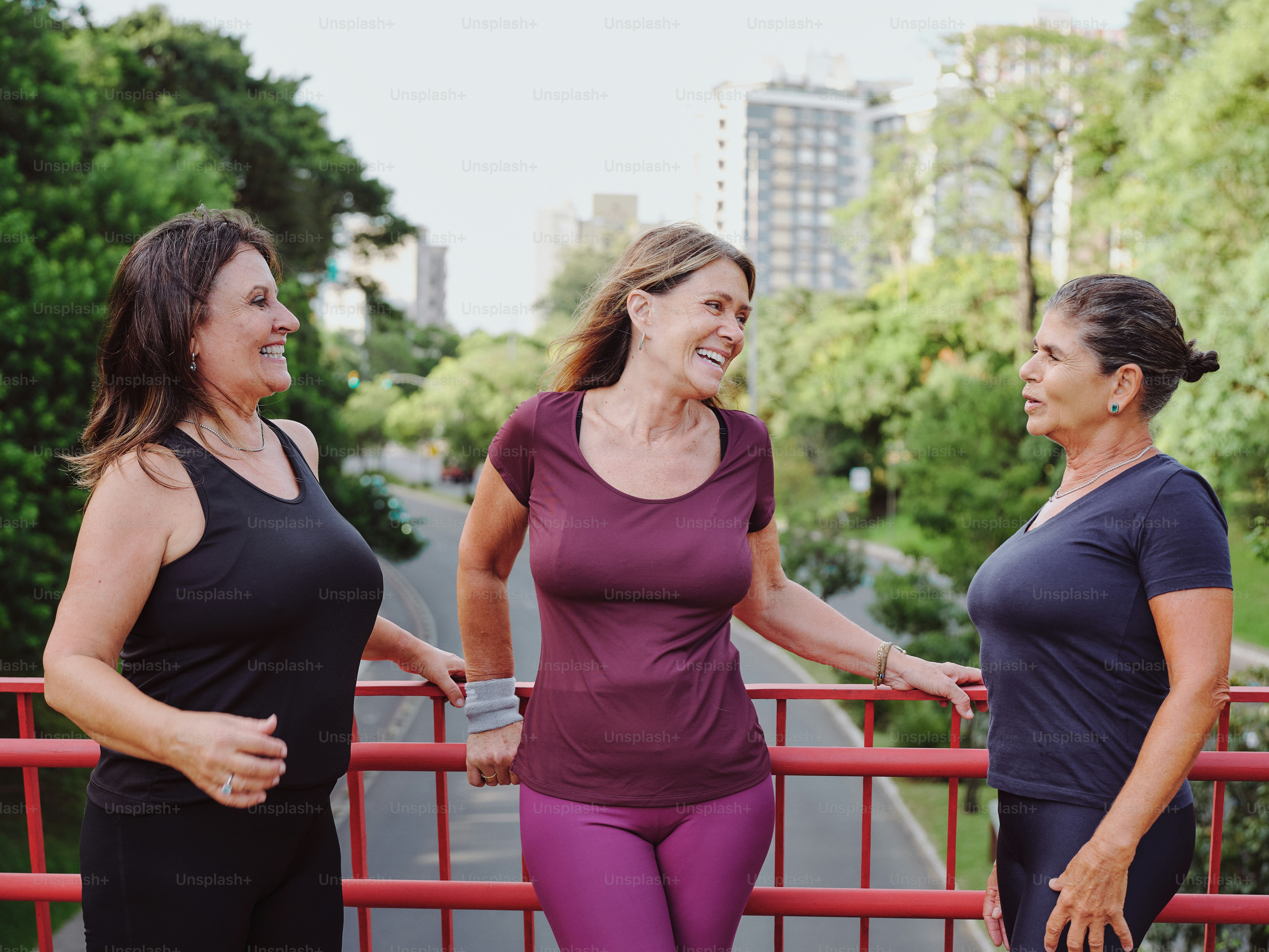 A group of three women standing next to each other photo – Friends ...