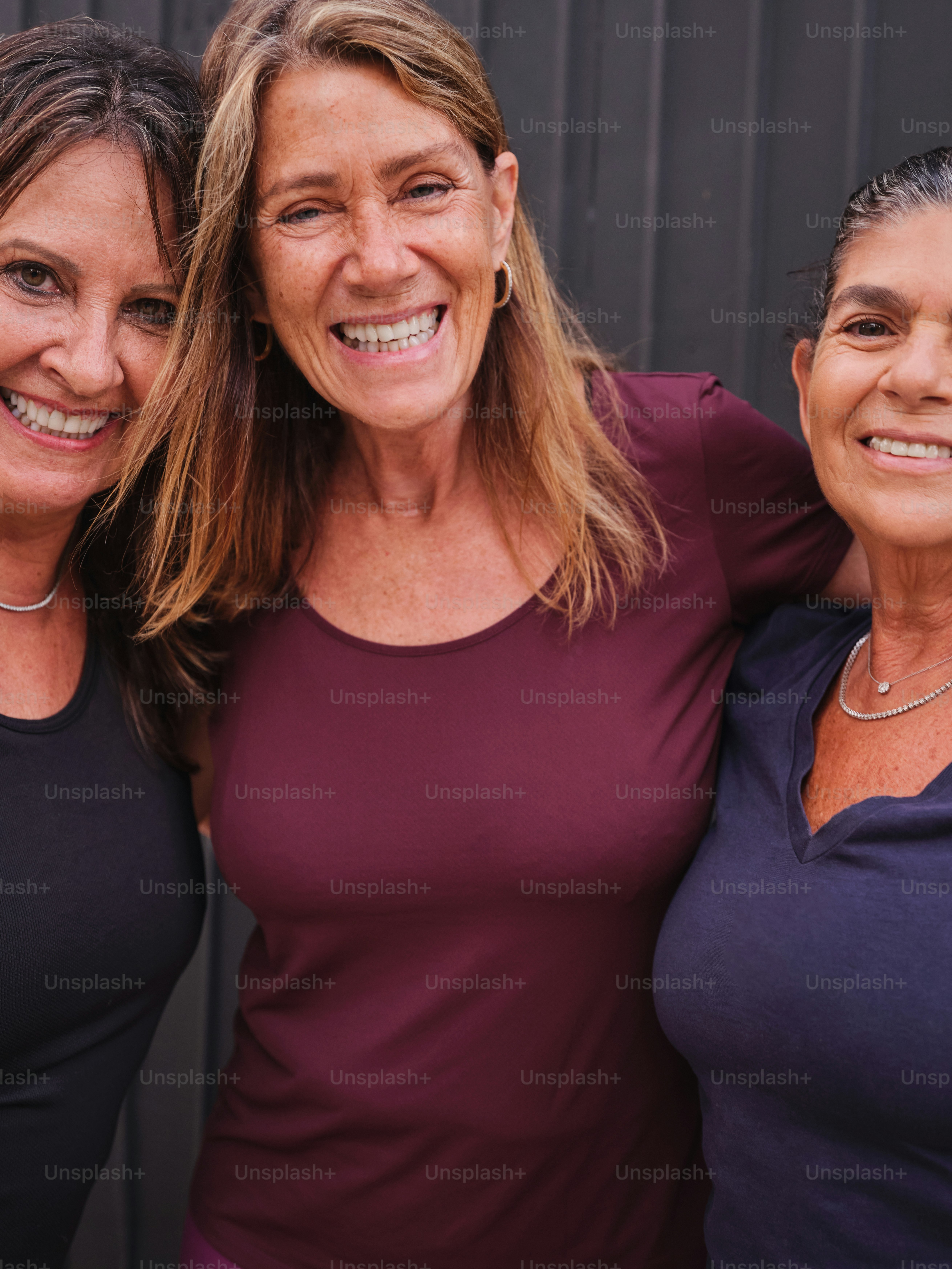 A group of three women standing next to each other photo – Portrait ...