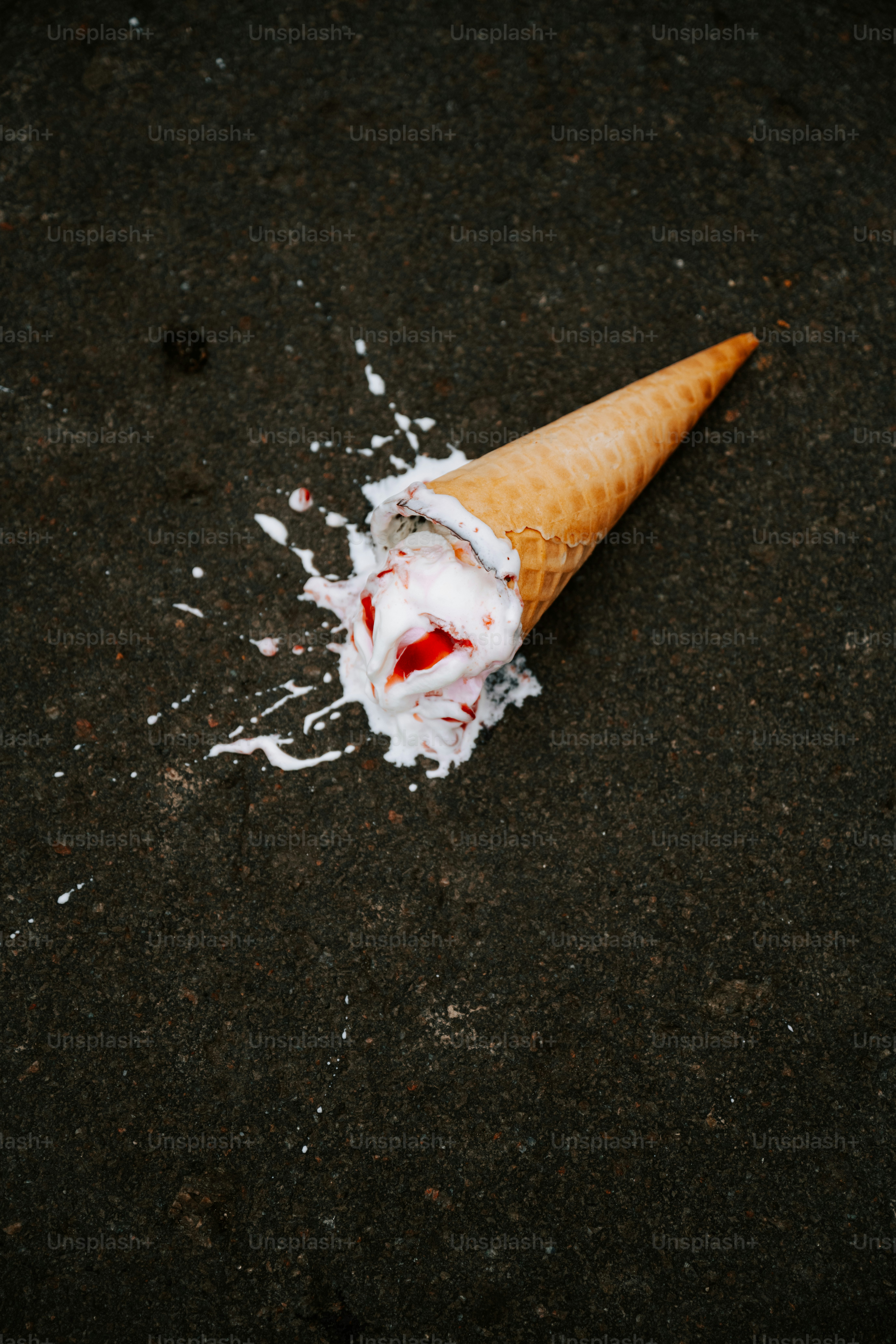 An ice cream cone with a bite taken out of it photo – Humour Image on ...