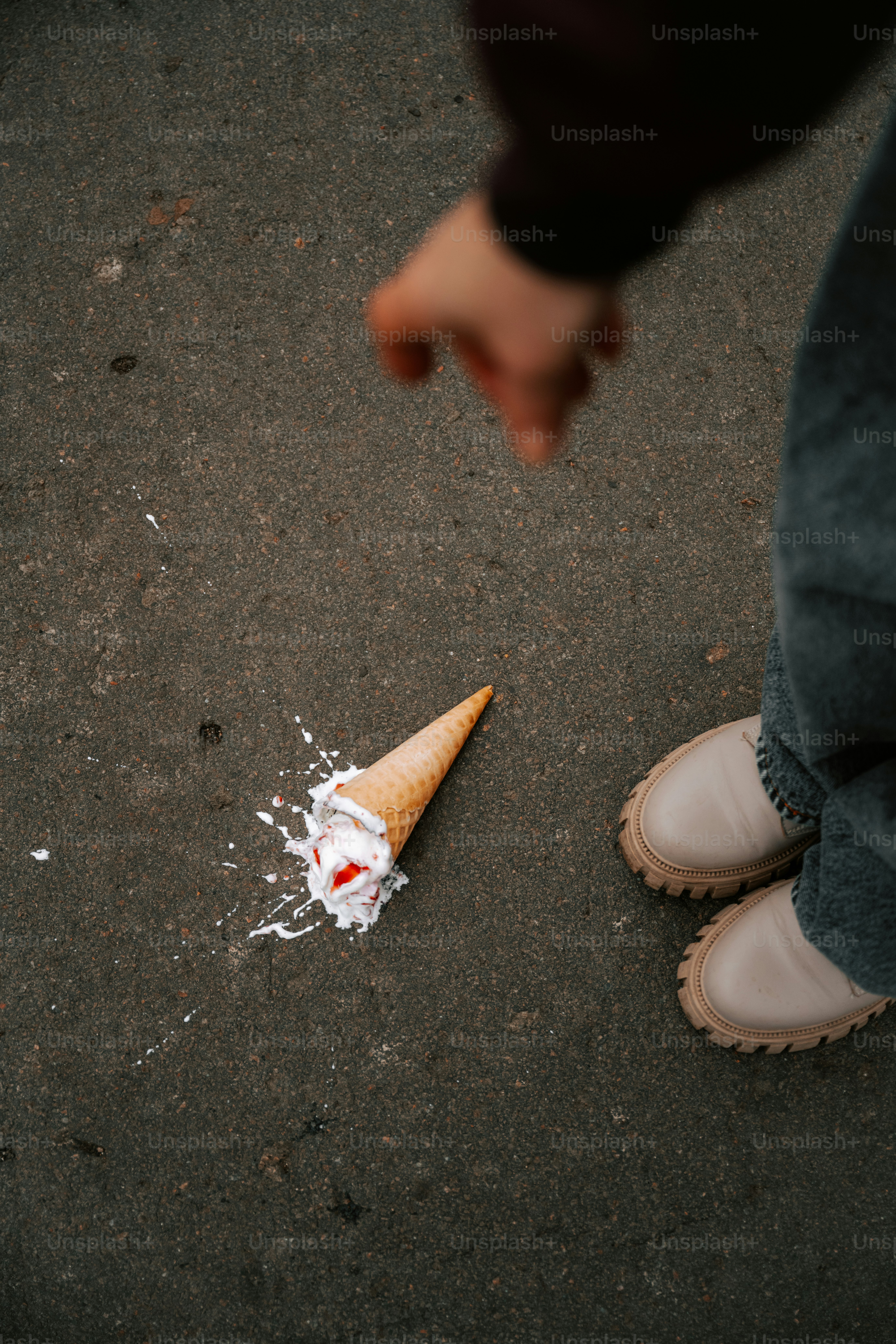 An ice cream cone with a bite taken out of it photo – Playful Image on ...