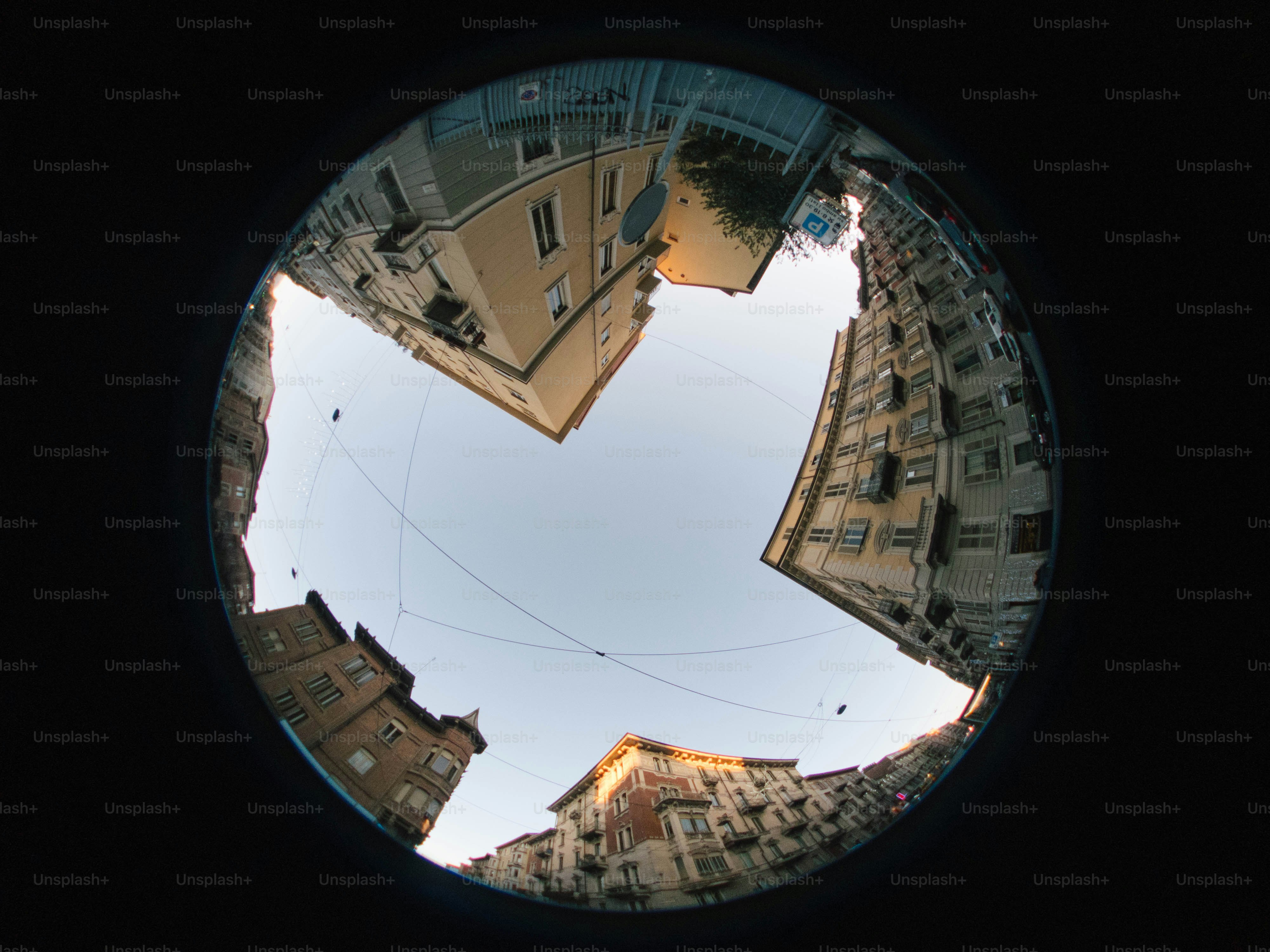 A fish eye view of a city with tall buildings photo – Italy Image on ...