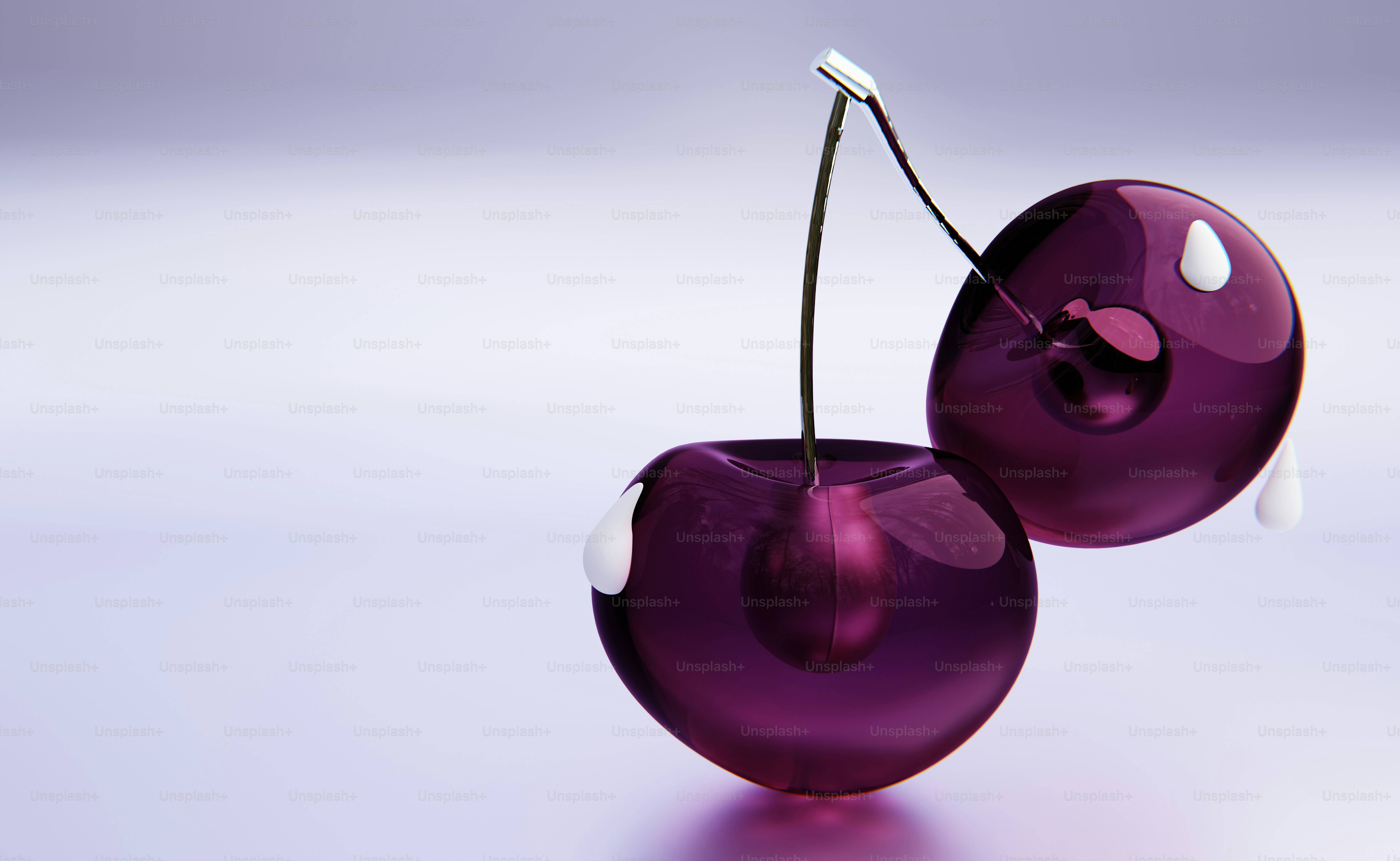 A pair of purple cherries sitting on top of a table photo – Abstract ...