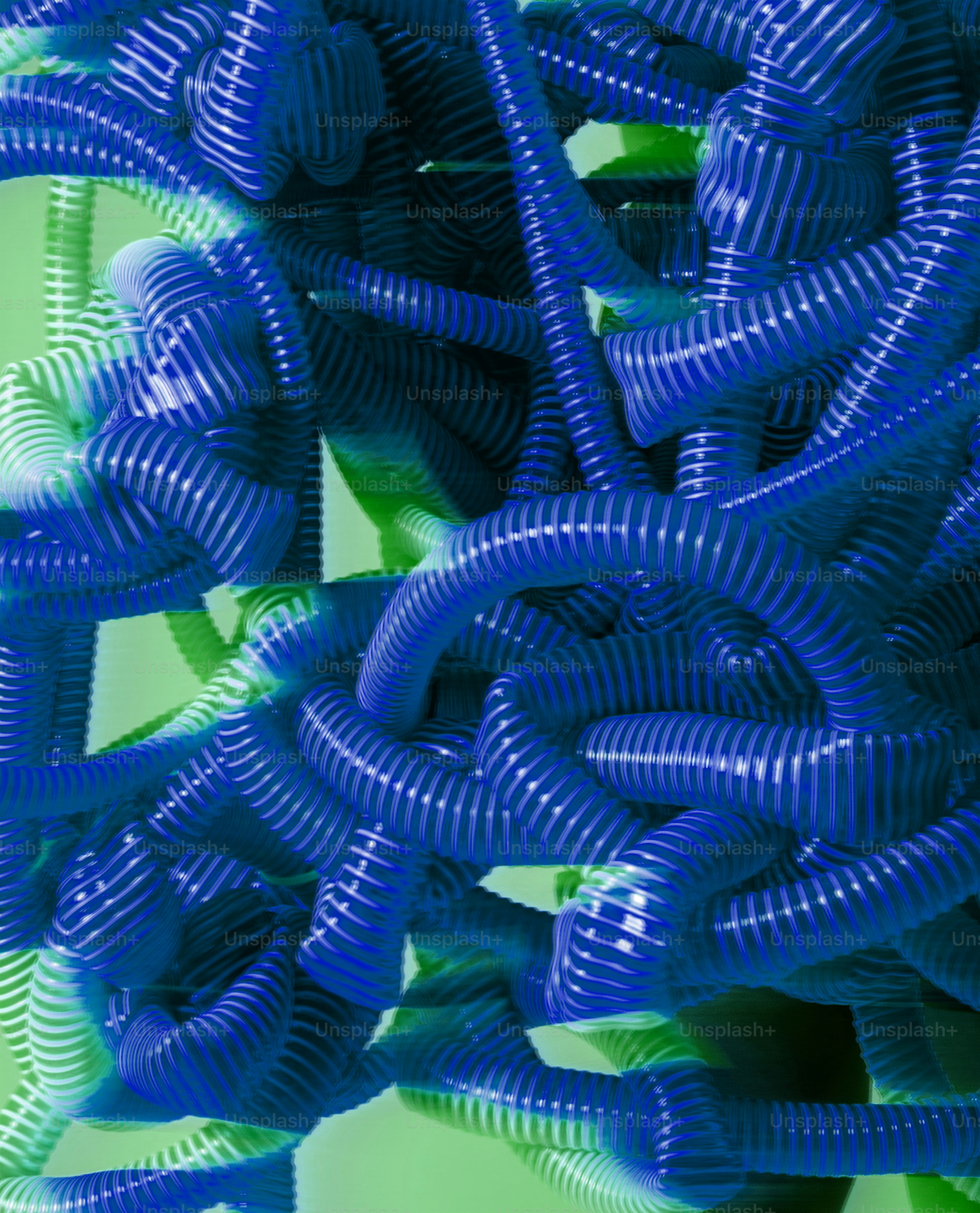 A close up of a bunch of blue hoses photo – Art Image on Unsplash